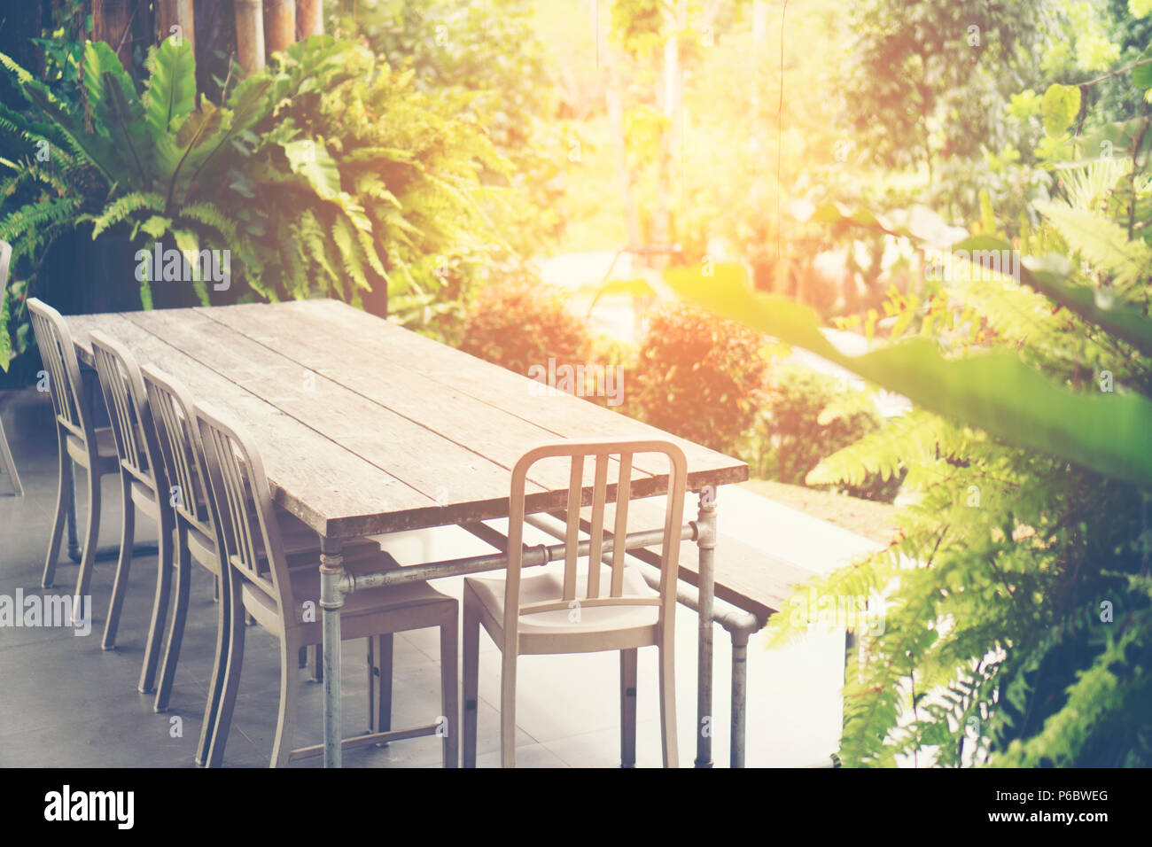 wooden table in coffee cafe, vintage filter image Stock Photo - Alamy