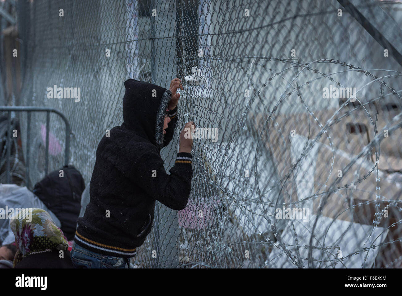 Barbed wire fence refugee woman hi-res stock photography and images - Alamy