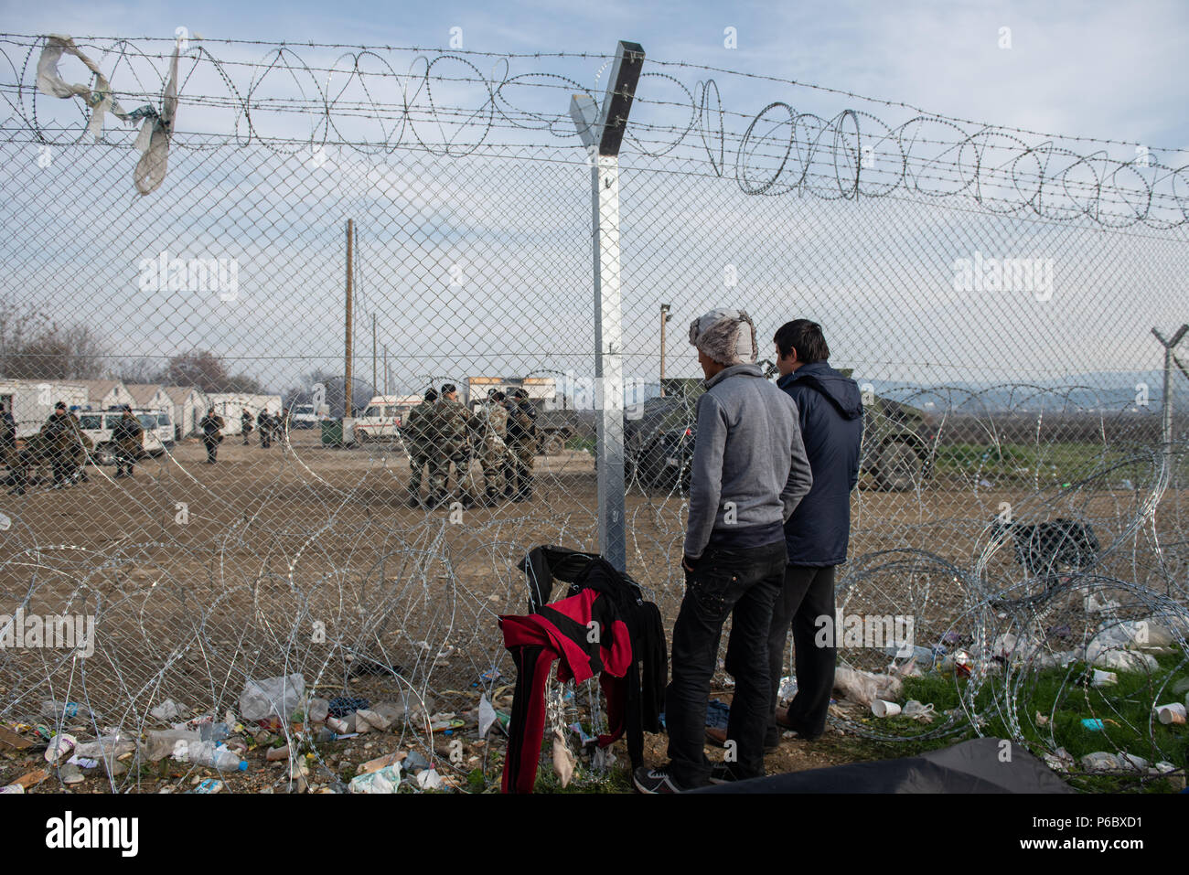 Barbed wire fence refugee woman hi-res stock photography and images - Alamy