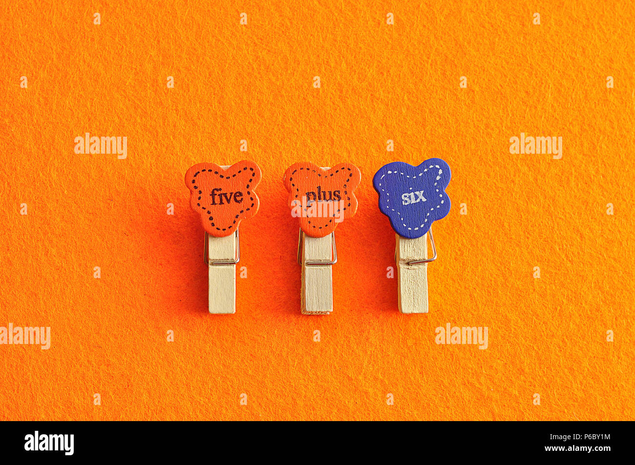 Five plus six on an orange background Stock Photo - Alamy