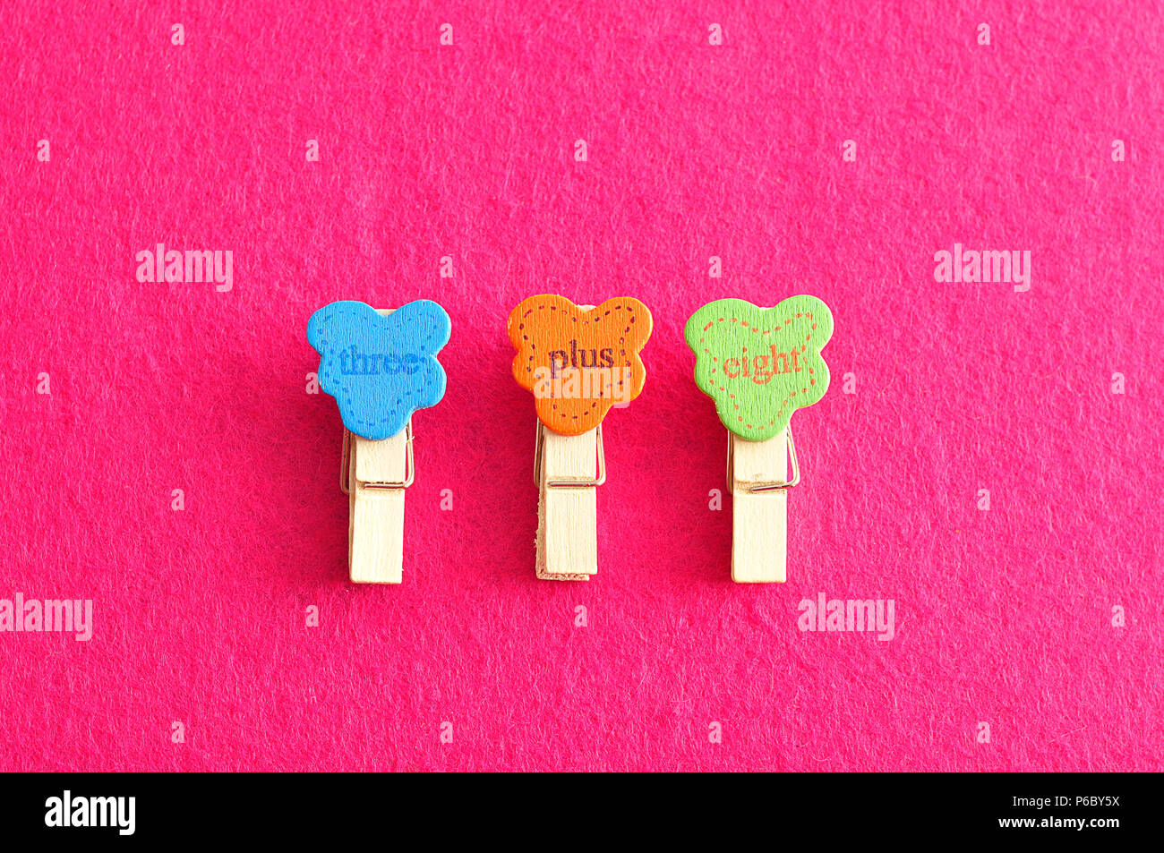 Three plus eight on a pink background Stock Photo - Alamy