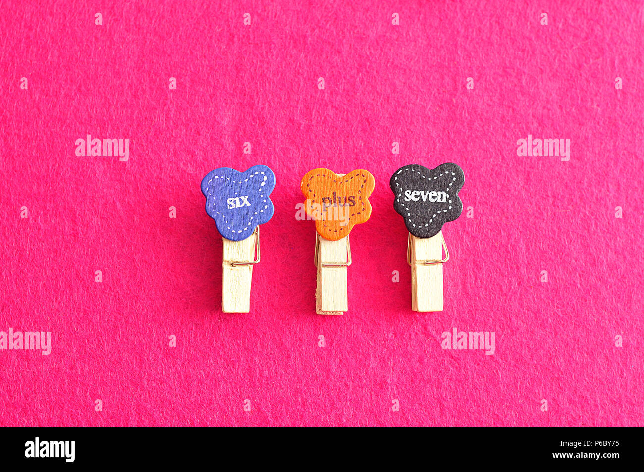 Six plus seven on a pink background Stock Photo - Alamy