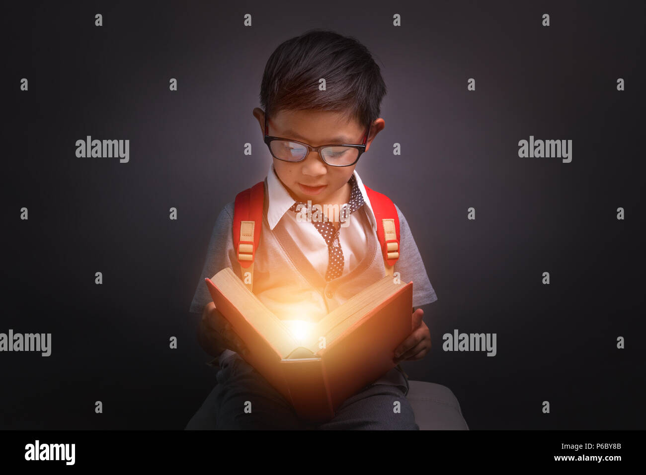 Back to school, Child opened a magic book, Image dark tone Stock Photo ...