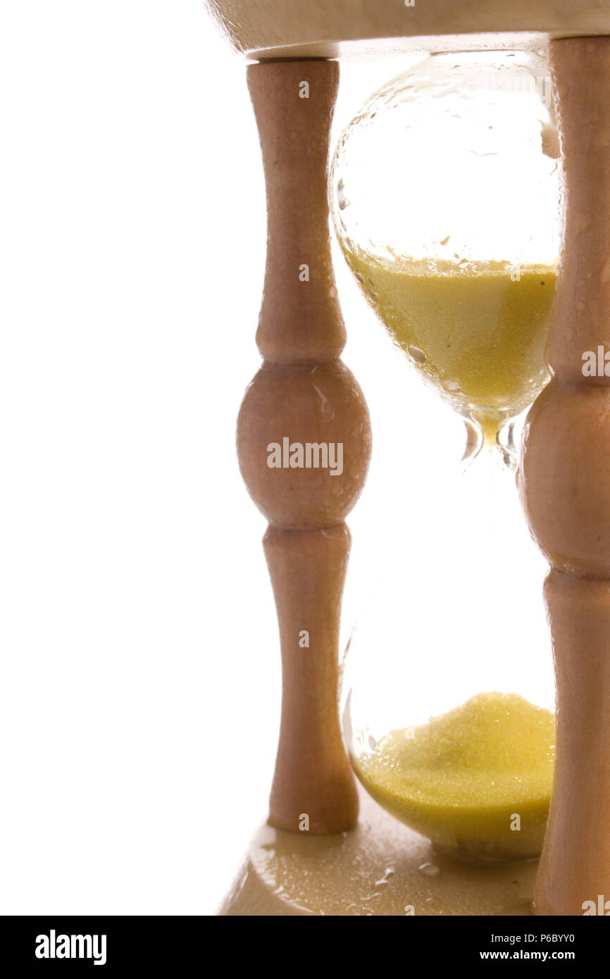 wet sand clock showing how is time passing on white background Stock ...