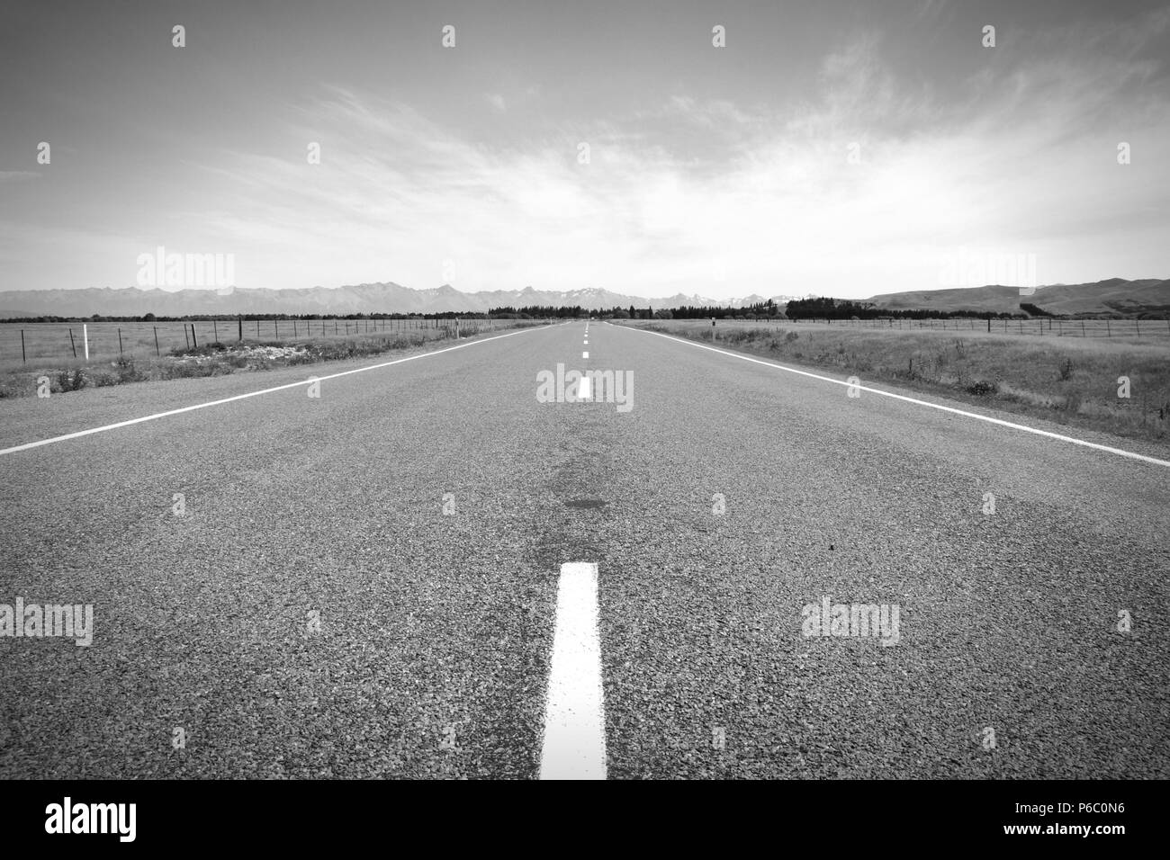 New Zealand. Straight road. Plains and mountains in Canterbury region ...