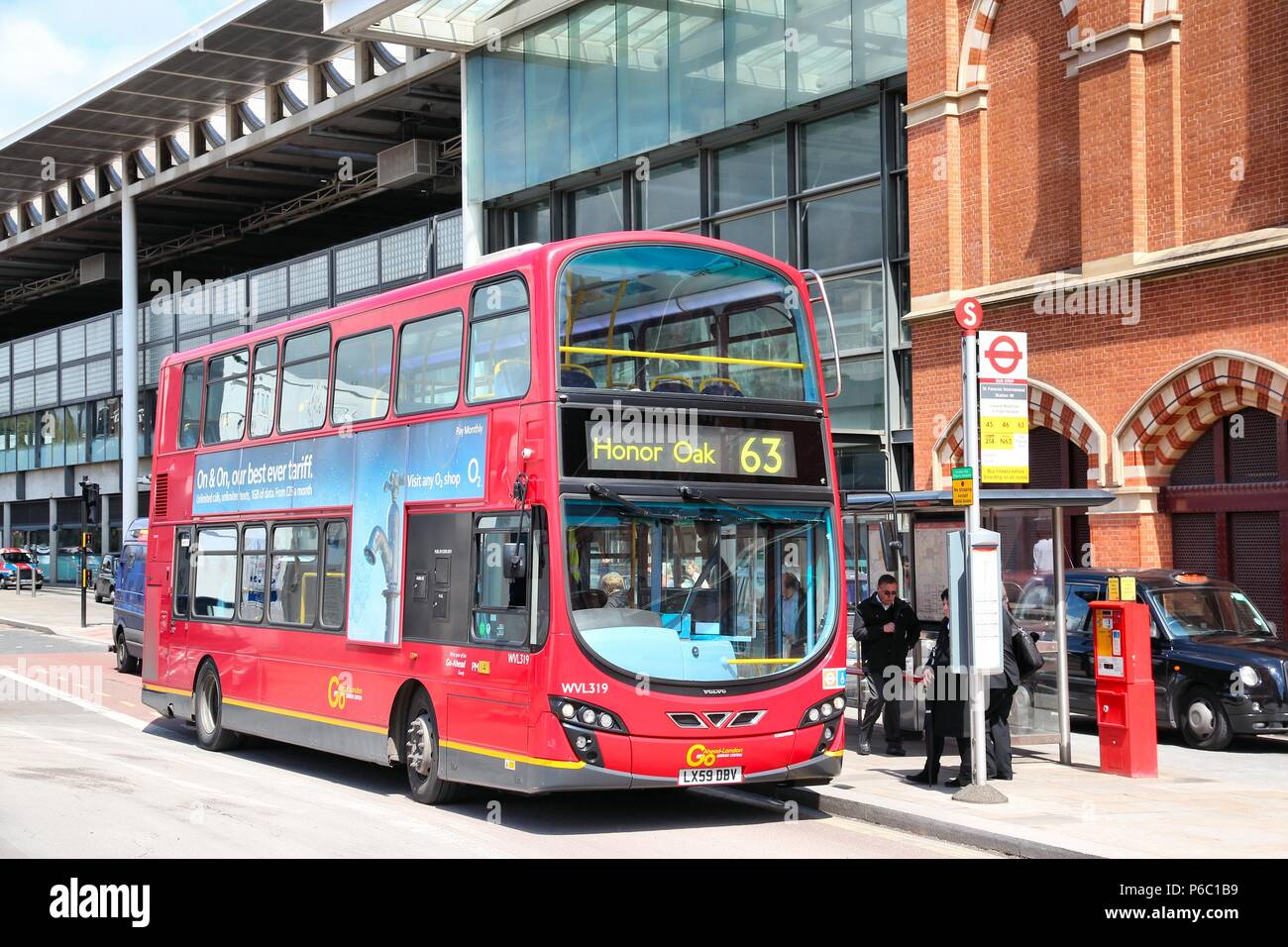 LONDON - MAY 15: People ride London Bus on May 15, 2012 in London. As ...