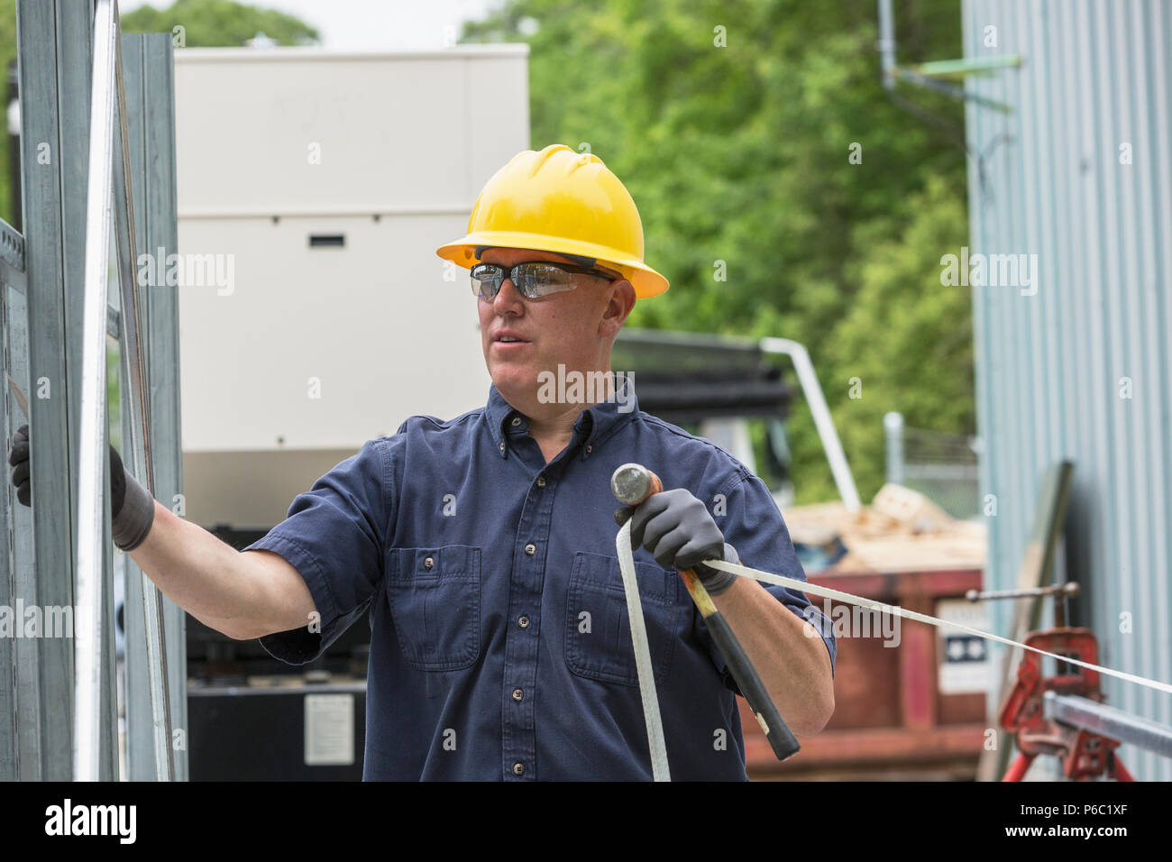 Engineer preparing to pull cable Stock Photo - Alamy