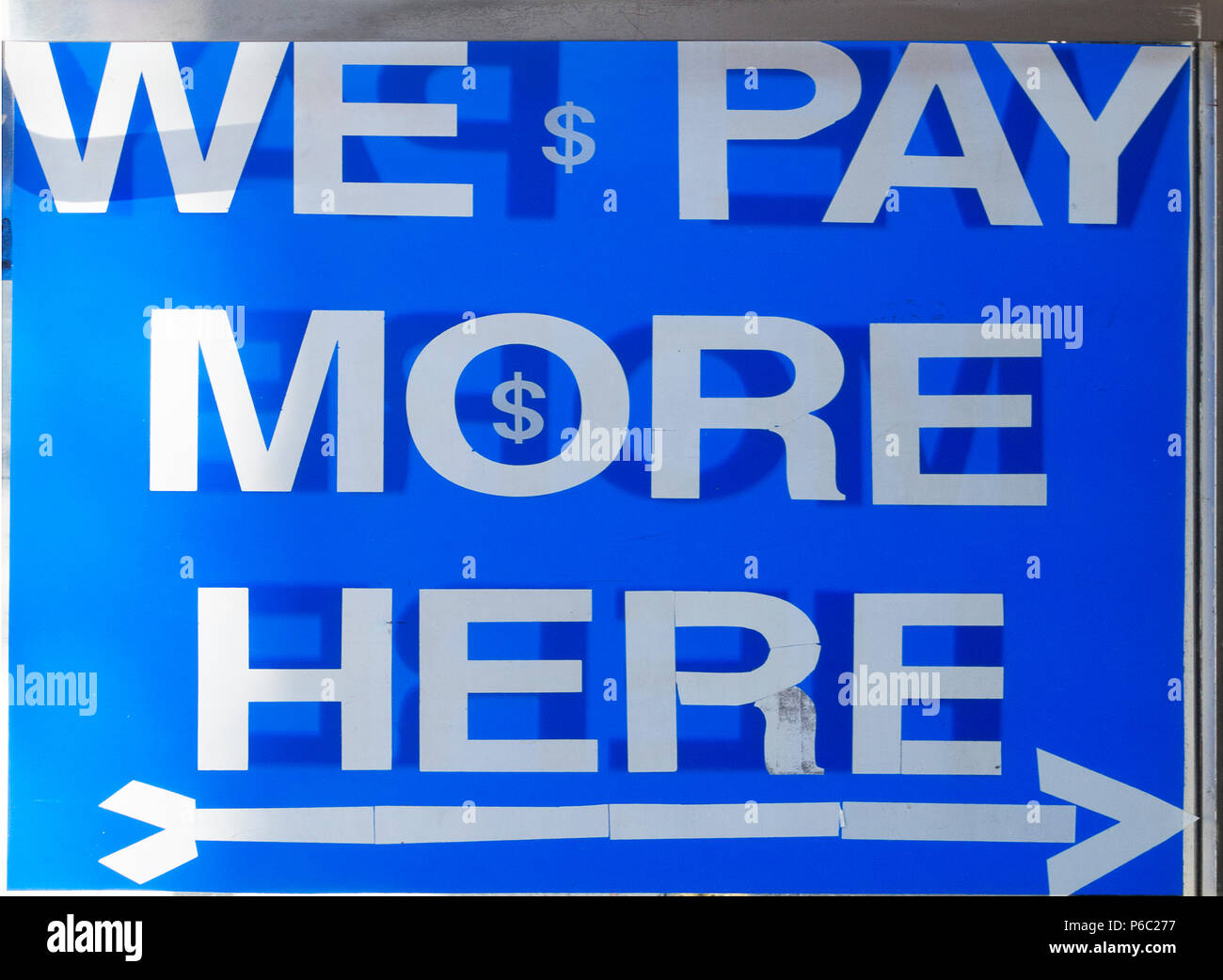 we pay more here sign Stock Photo - Alamy