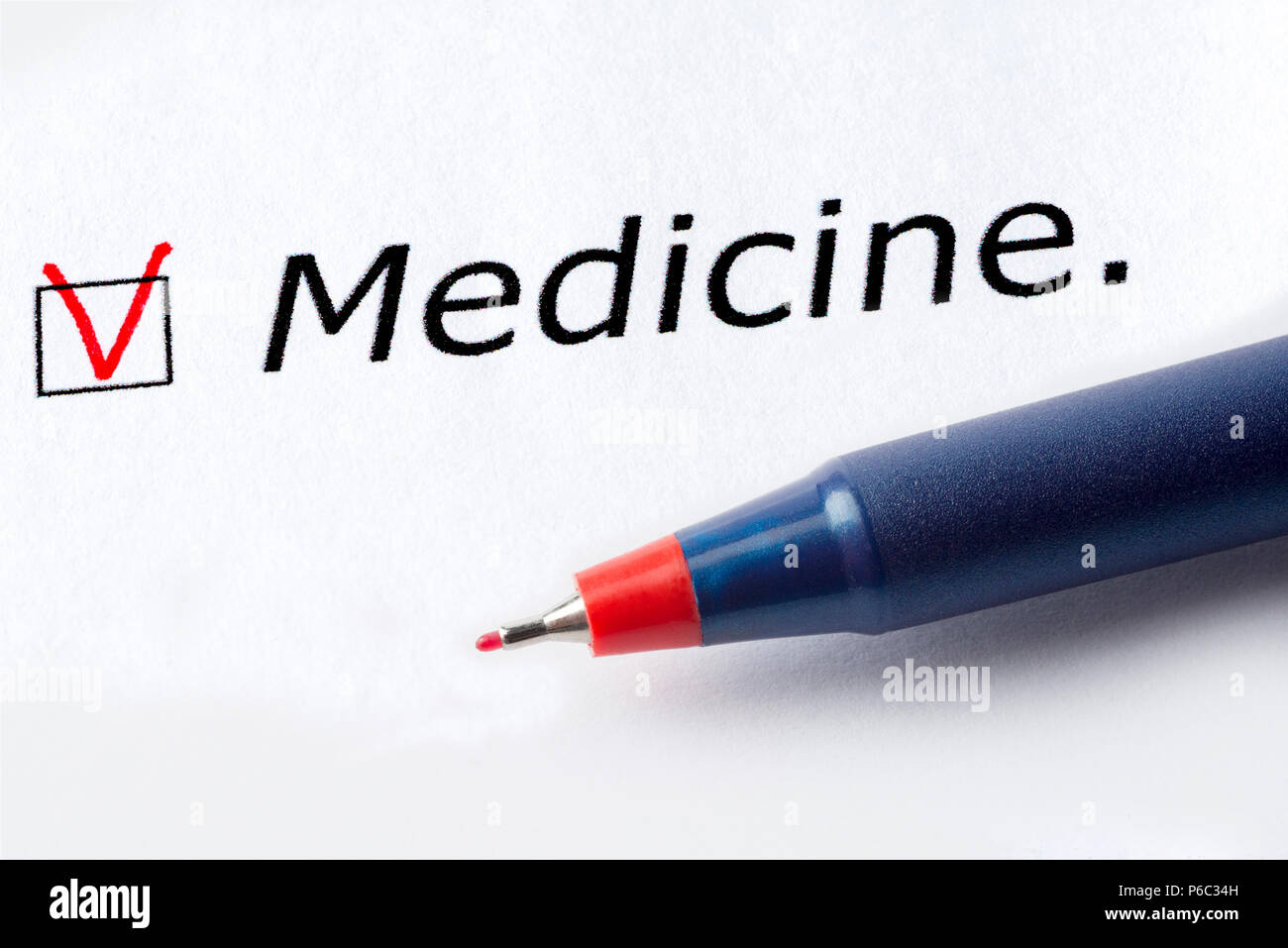 The word medicine is printed on a white background. Check mark in red ...