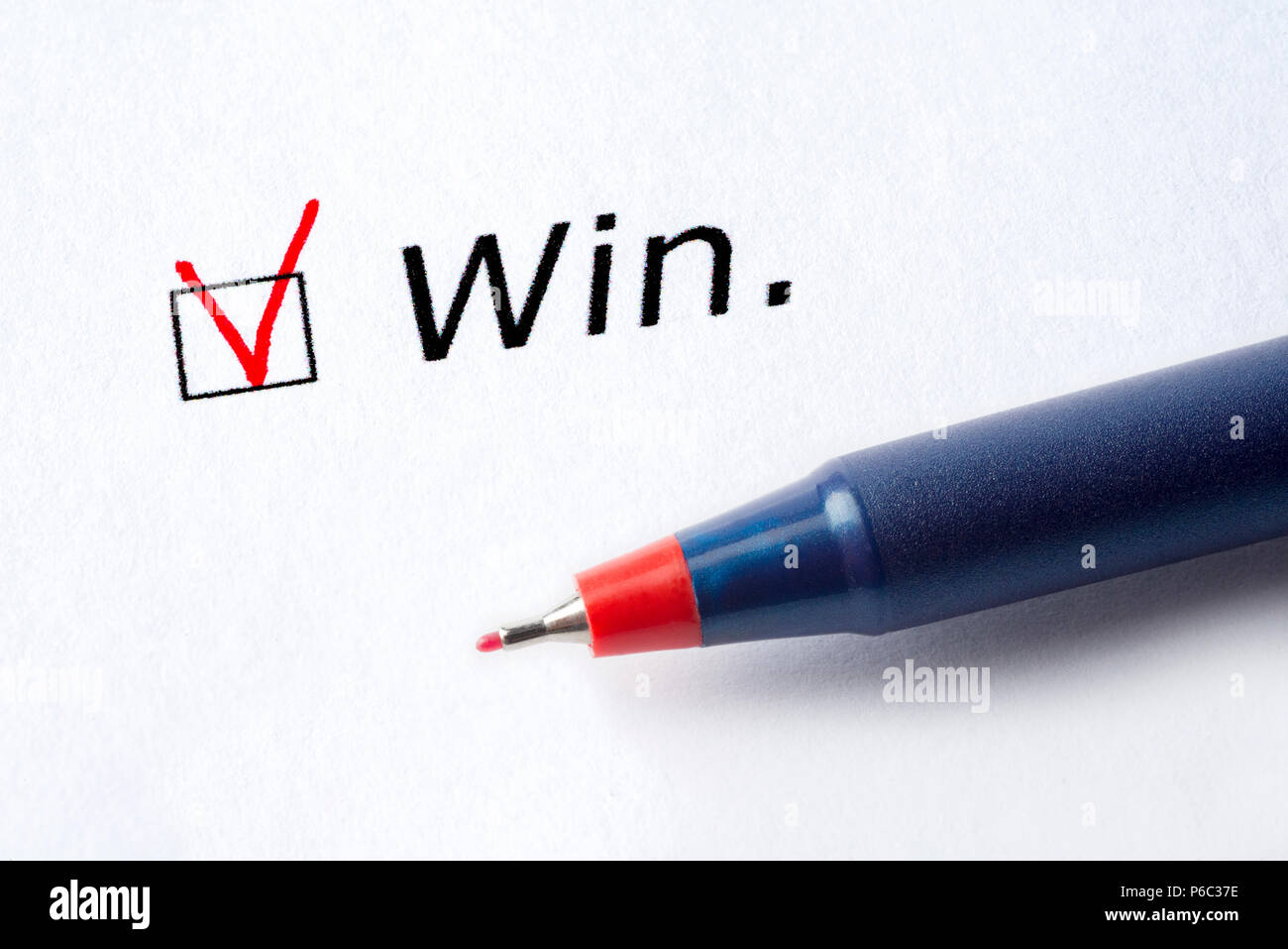 The word win is printed on a white background. Check mark in red ...