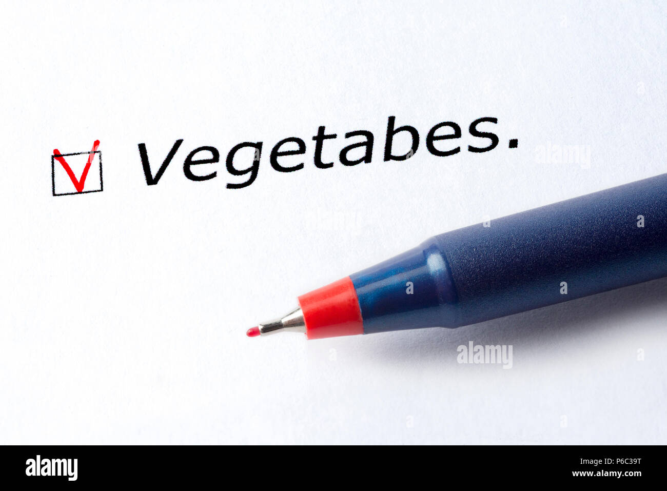 The word vegetables is printed on a white background. Check mark in red ...