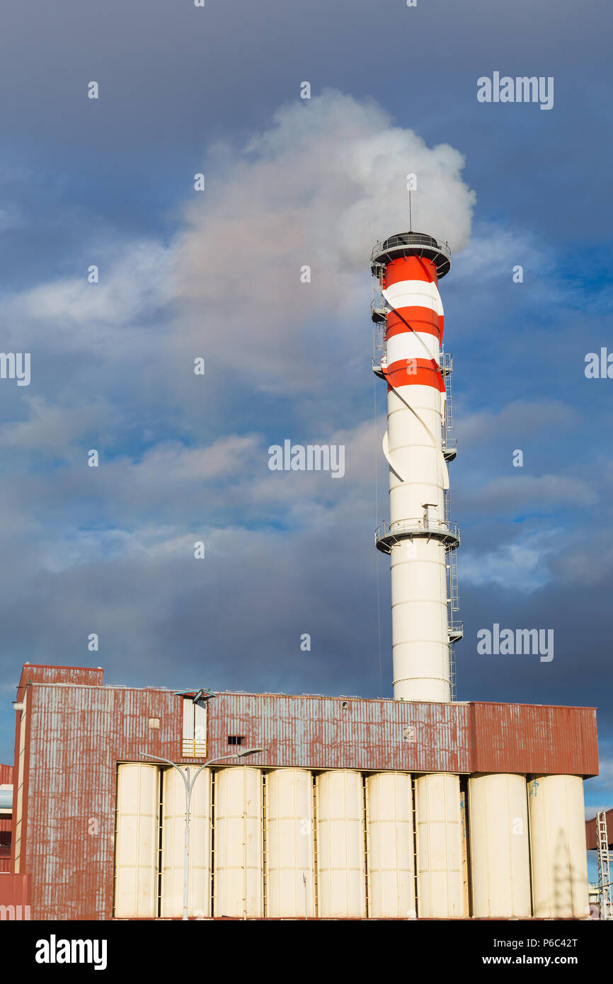 view of a factory chimney with smoke releasing Stock Photo - Alamy