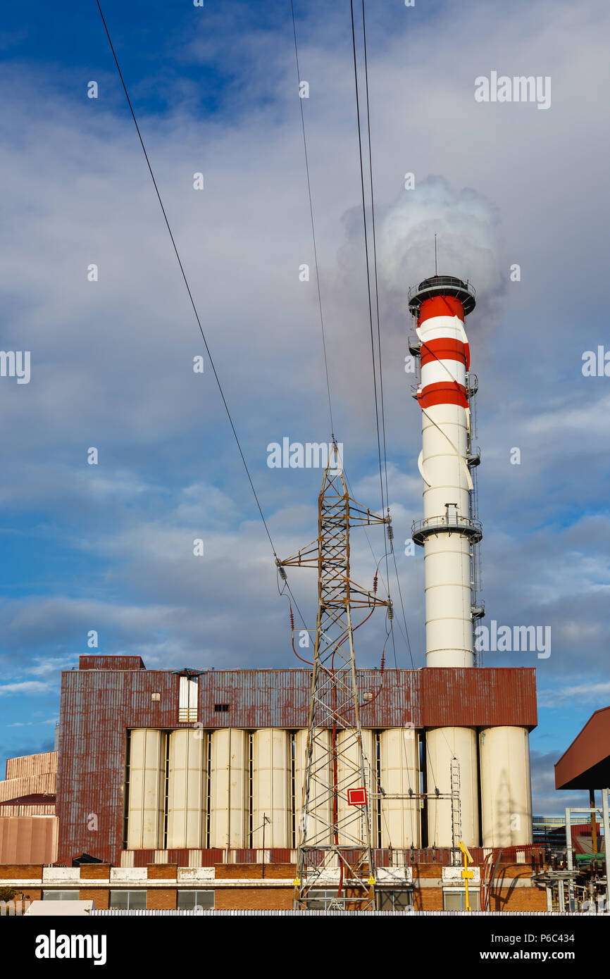 view of a factory chimney with smoke releasing Stock Photo - Alamy