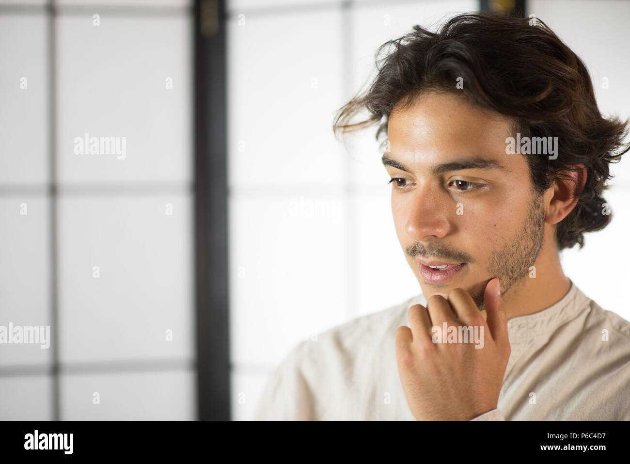 Touching his chin hi-res stock photography and images - Alamy