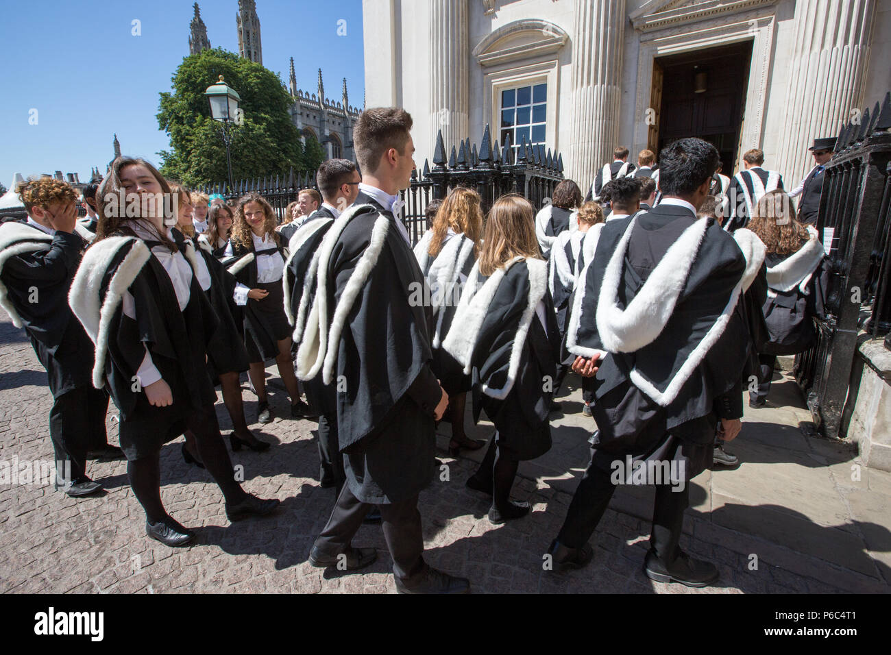 Students from Cambridge University on their way to the Senate House to ...