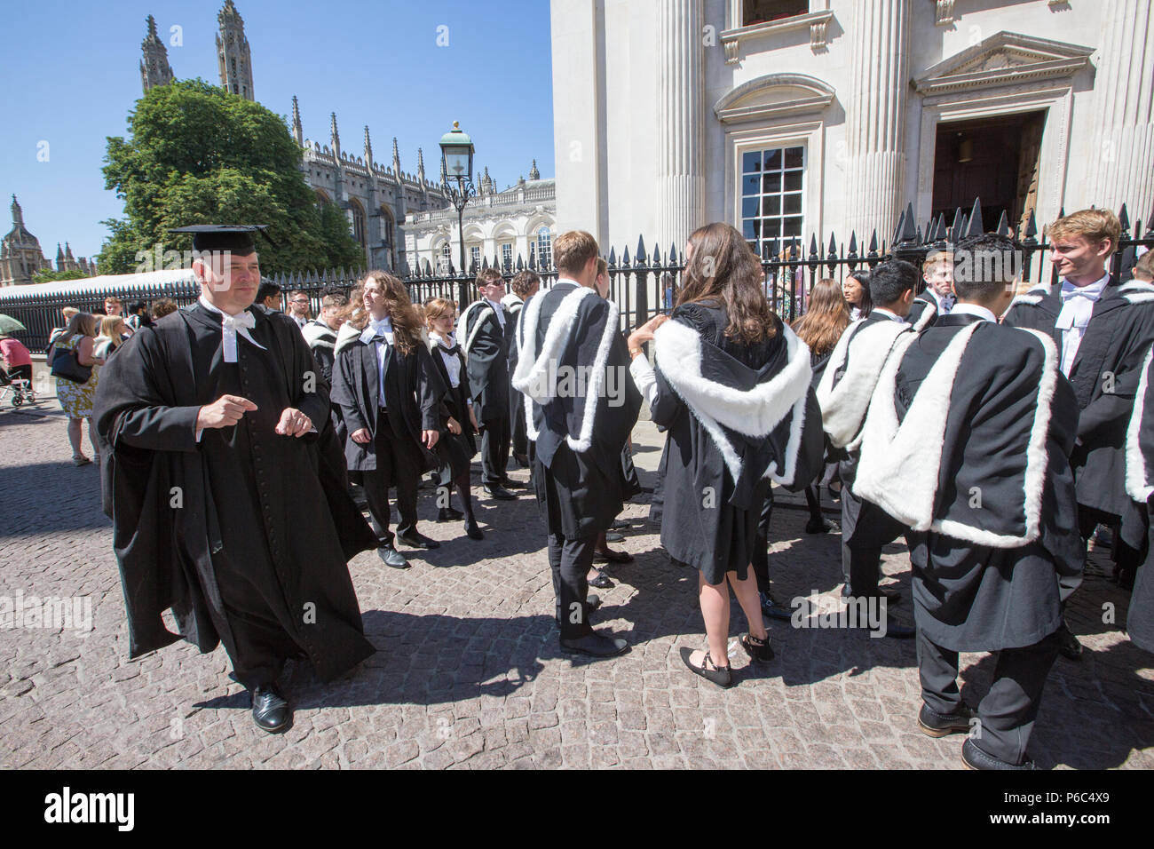 Students from Cambridge University on their way to the Senate House to ...