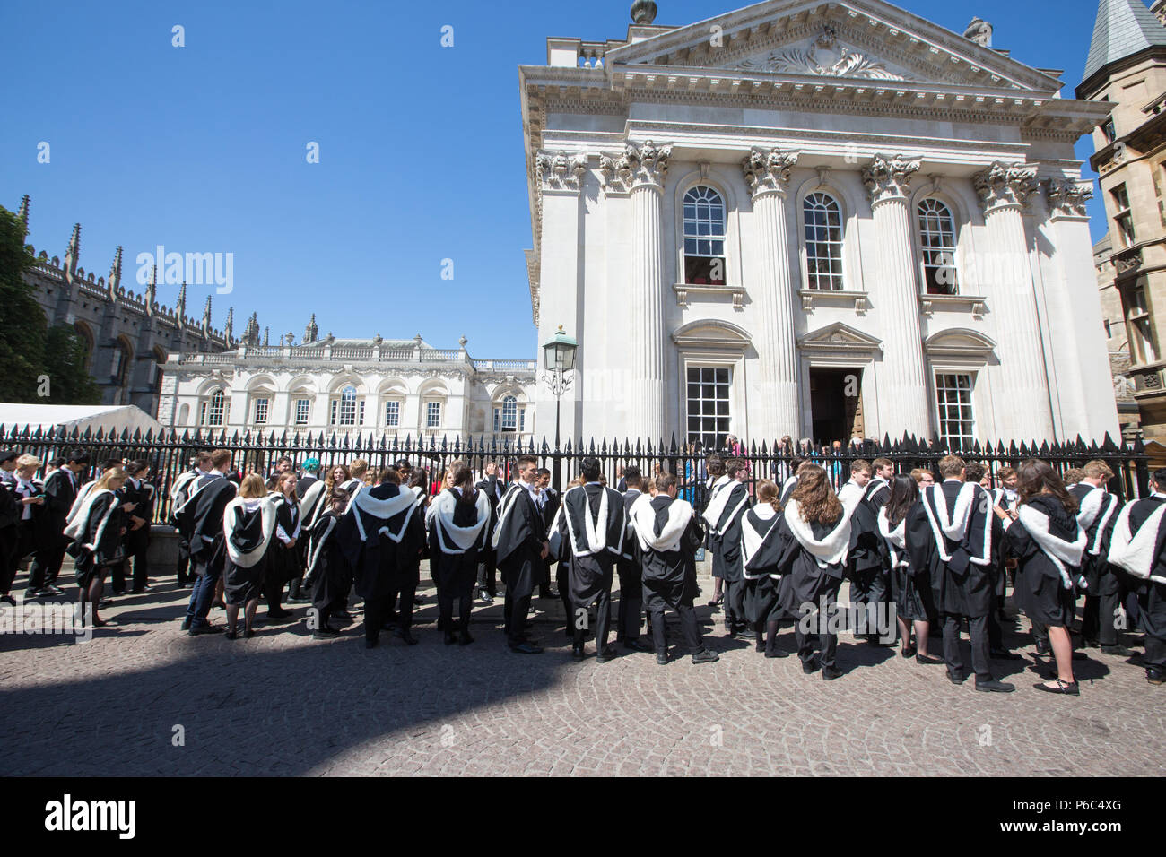 Students from Cambridge University on their way to the Senate House to ...