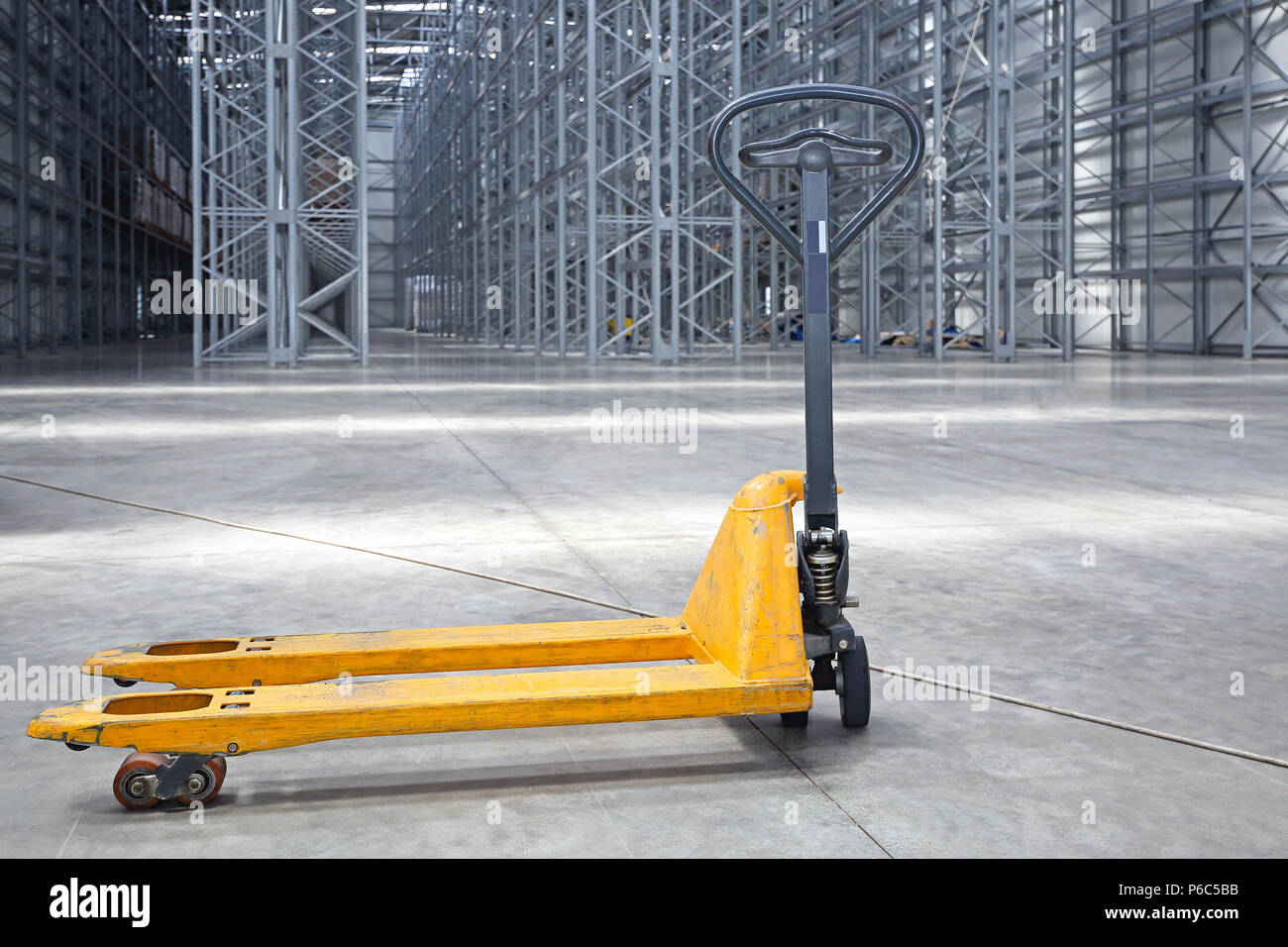 Manual Pallet Jack in Distributin Center Warehouse Stock Photo - Alamy