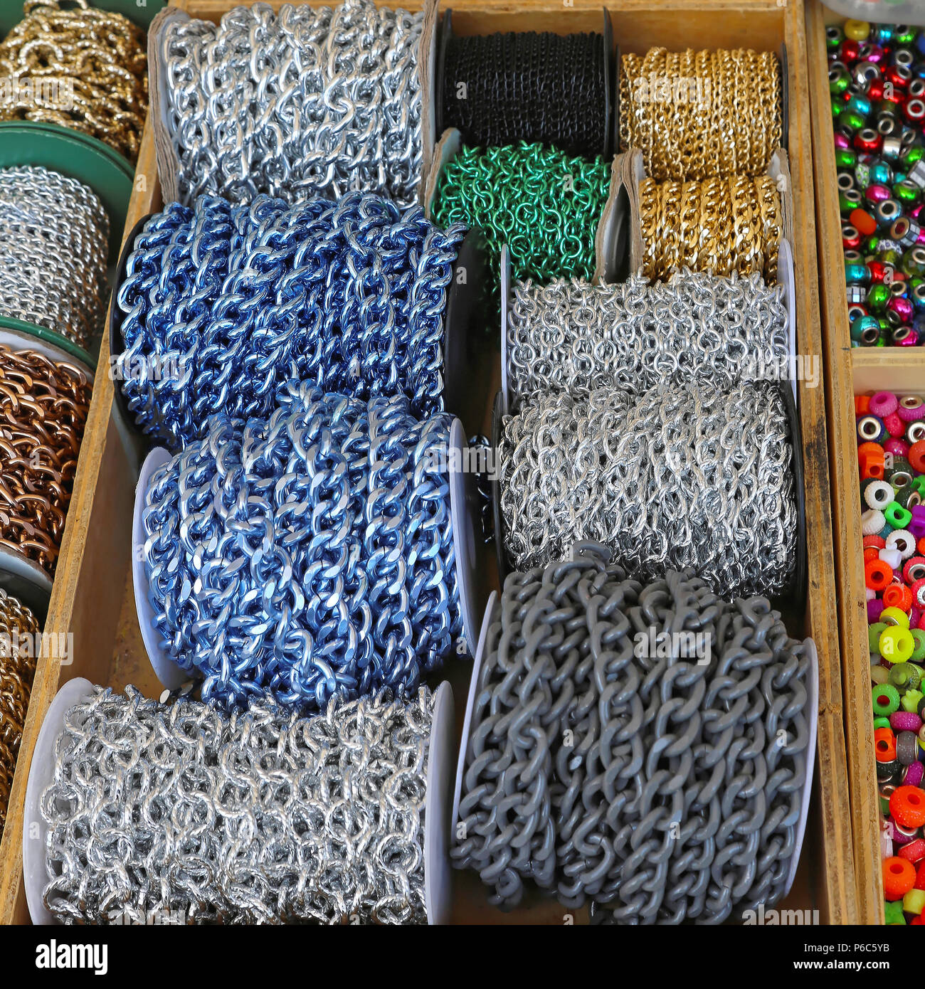 Decorative metallic chains at reels for jewellery making Stock Photo ...