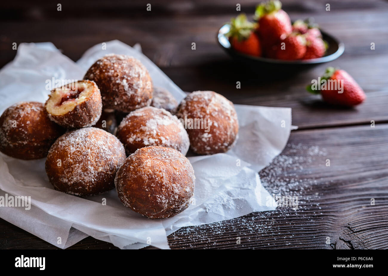 Bomboloni - traditional Italian doughnuts stuffed with strawberry jam ...