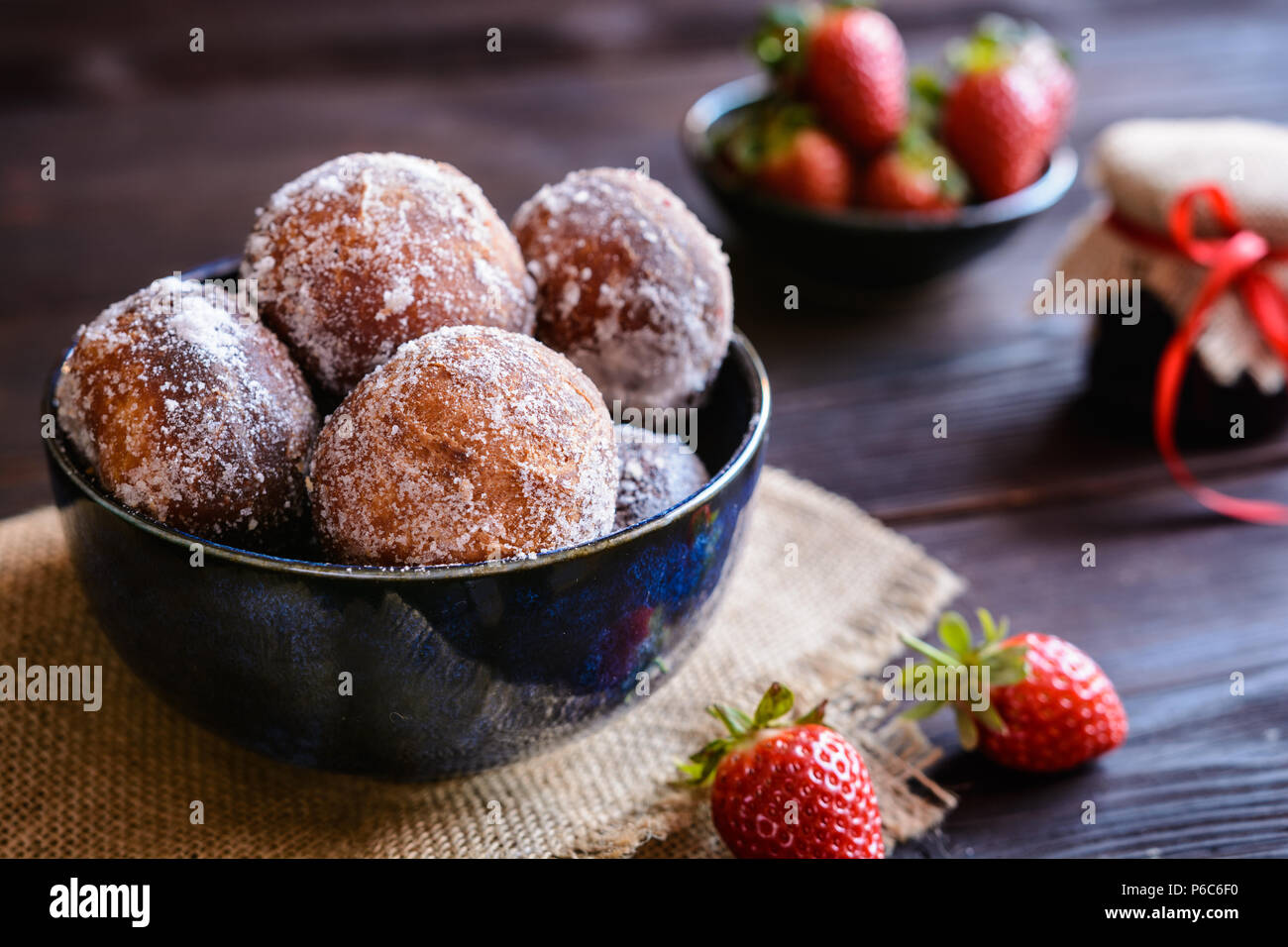 Bomboloni - traditional Italian doughnuts stuffed with strawberry jam ...