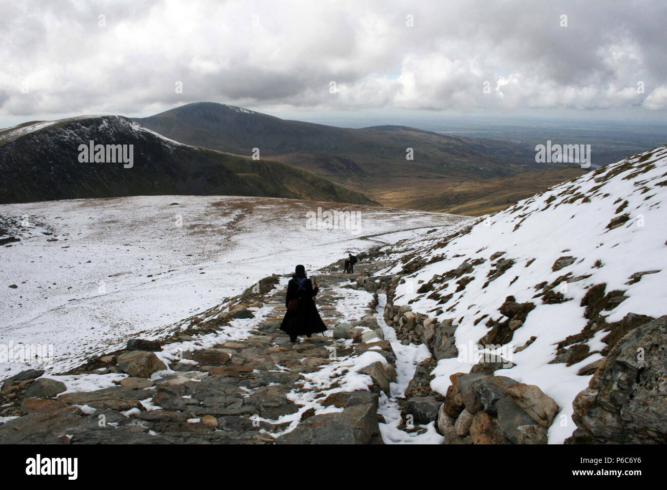 Walking down the long path, a snow covered trail from Snowdon to ...