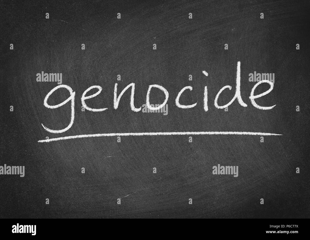genocide concept word on a blackboard background Stock Photo - Alamy