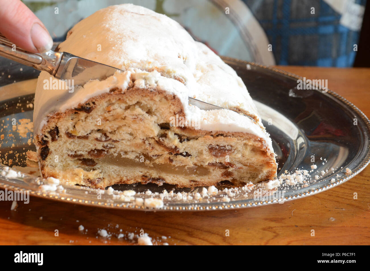 Christmas bread being cut Stock Photo - Alamy