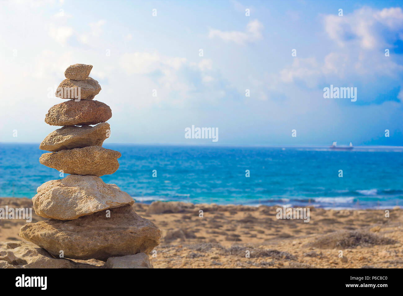Stones pyramid on background of Mediterranean sea. Seashore background ...