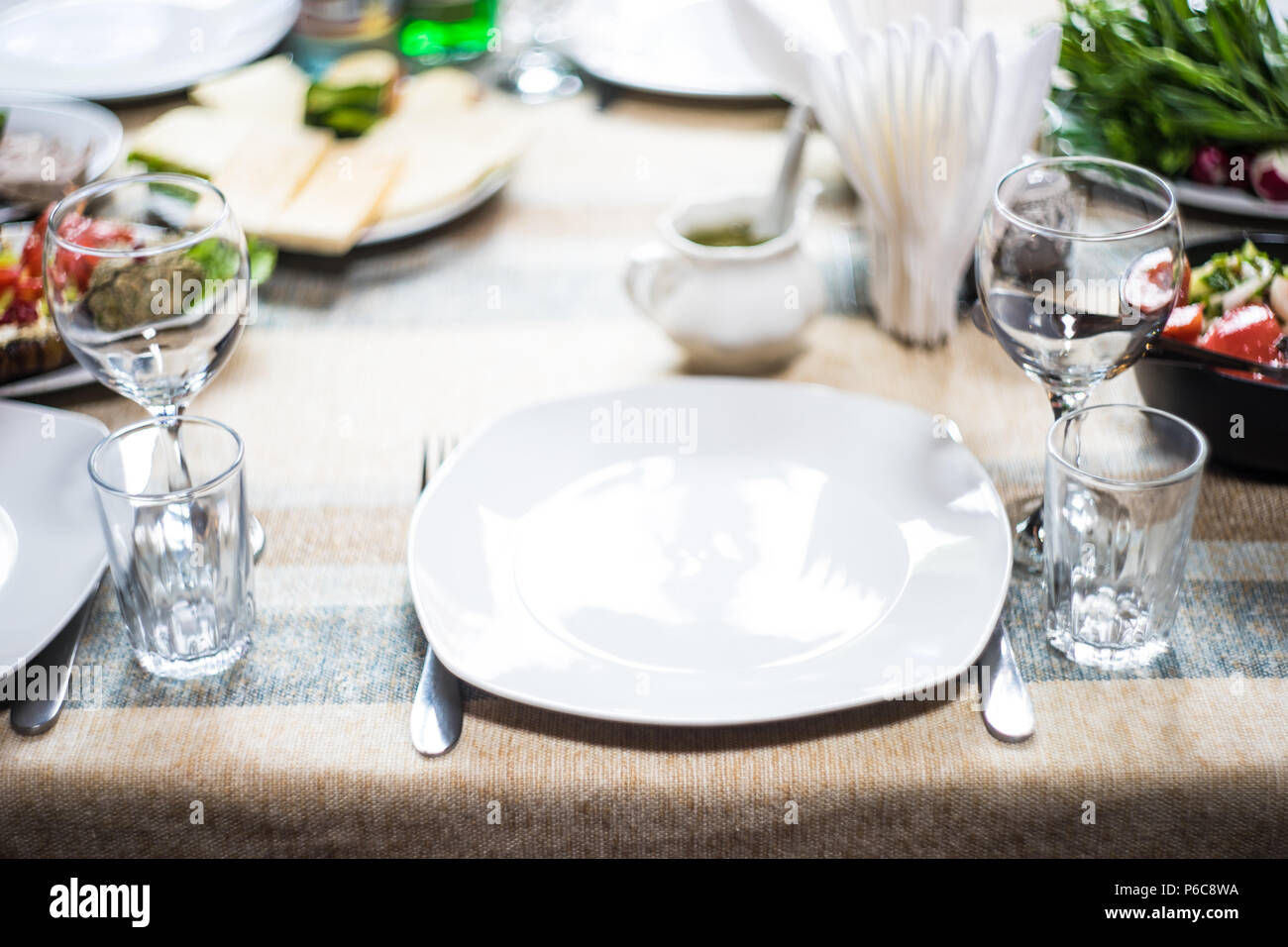 Traditional georgian table serving supra with greens and salads Stock ...
