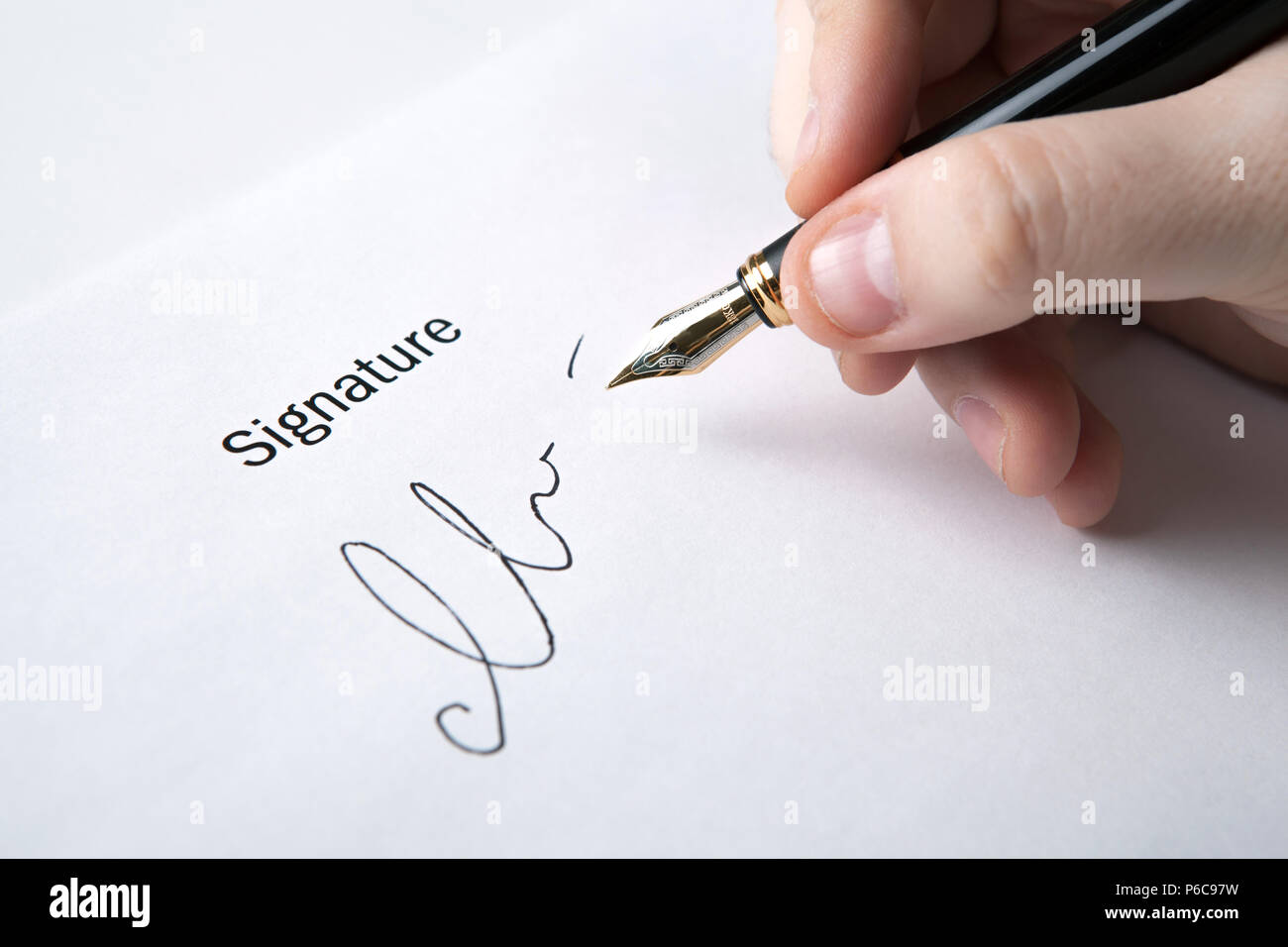 Mans hand signs document pen hi-res stock photography and images - Alamy