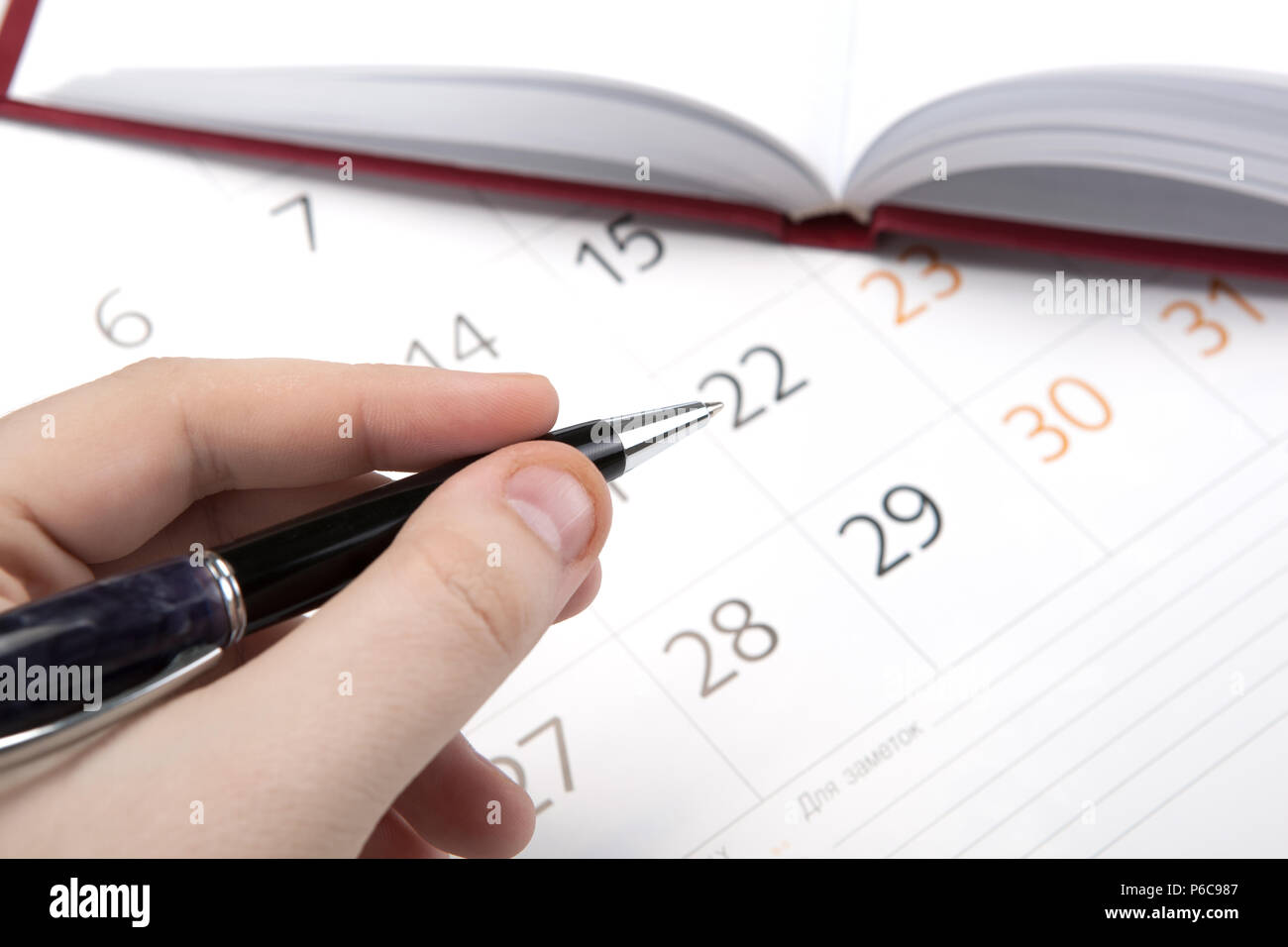 man is looking for information in the directory and calendar close-up ...