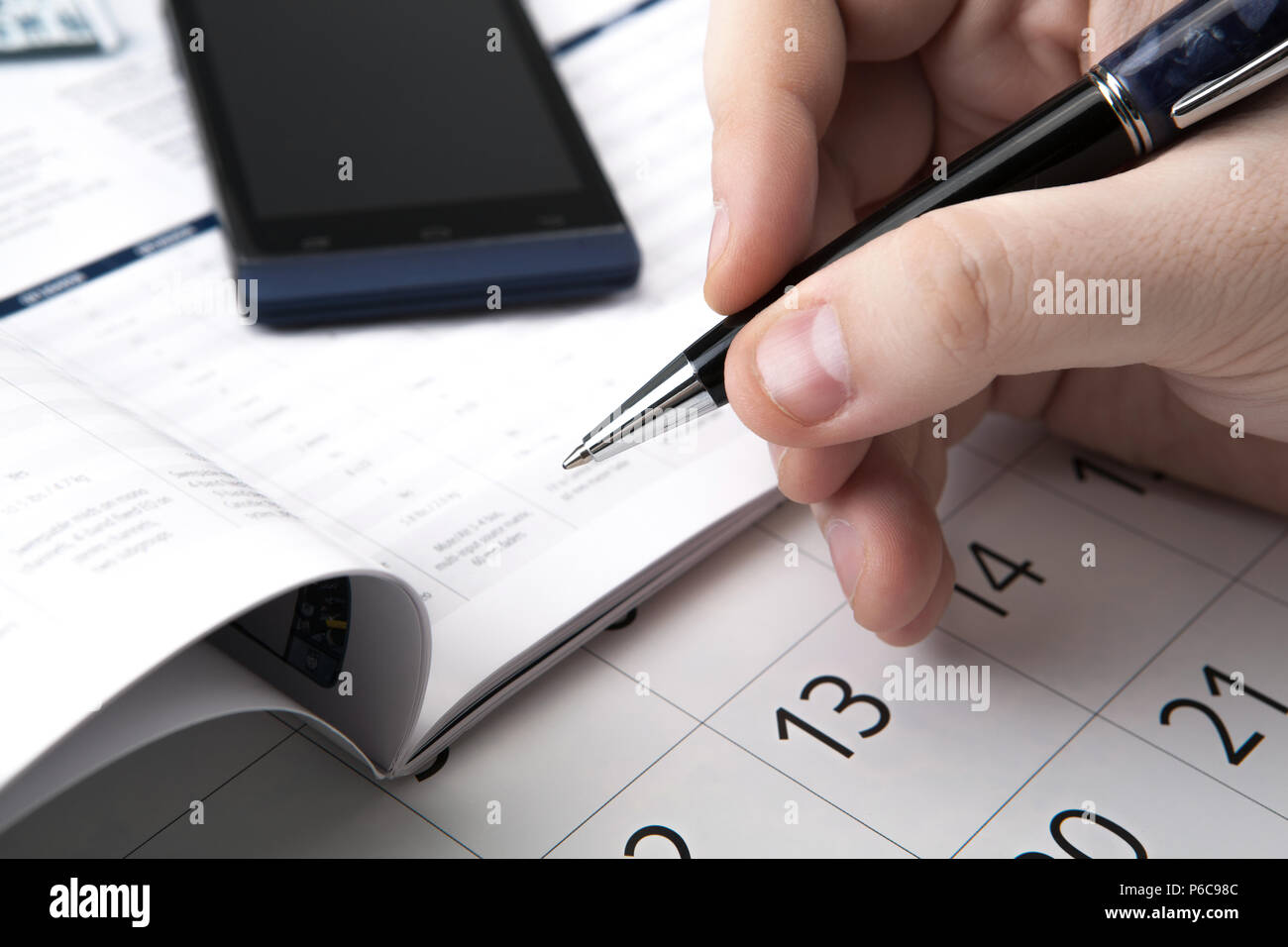 man is looking for information in the directory and calendar close-up ...