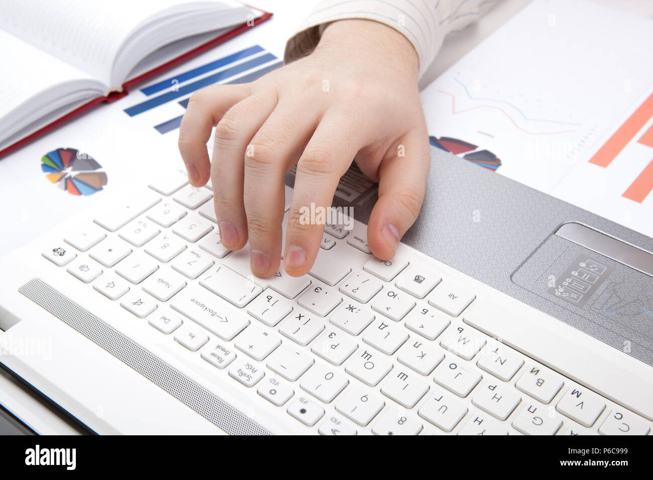 human hands on the notebook keyboard close-up Stock Photo - Alamy