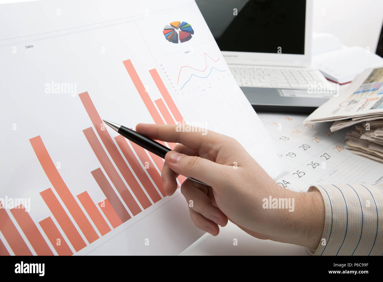 work studying the chart in the office closeup Stock Photo - Alamy