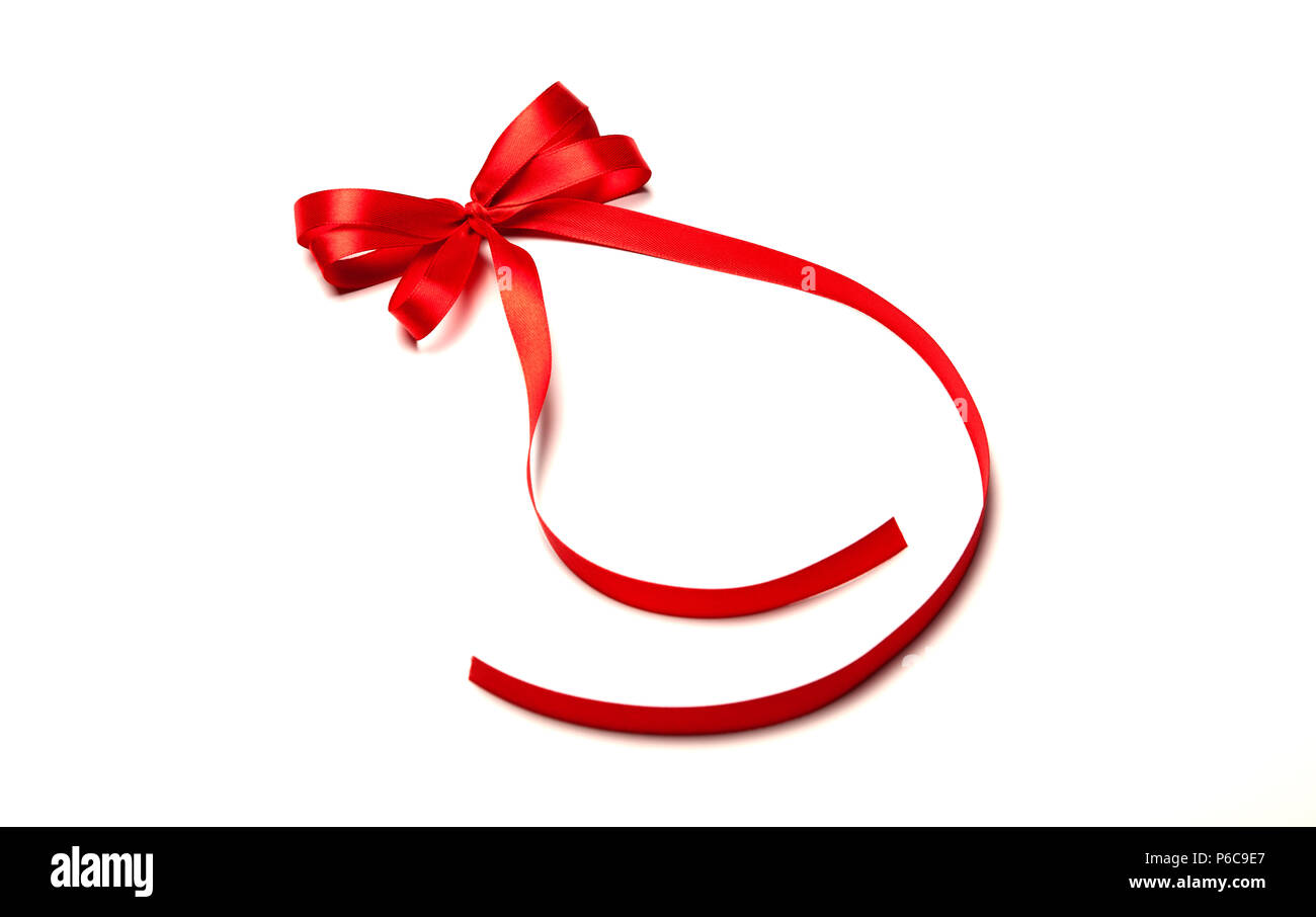 red ribbon with a bow on a white Stock Photo - Alamy