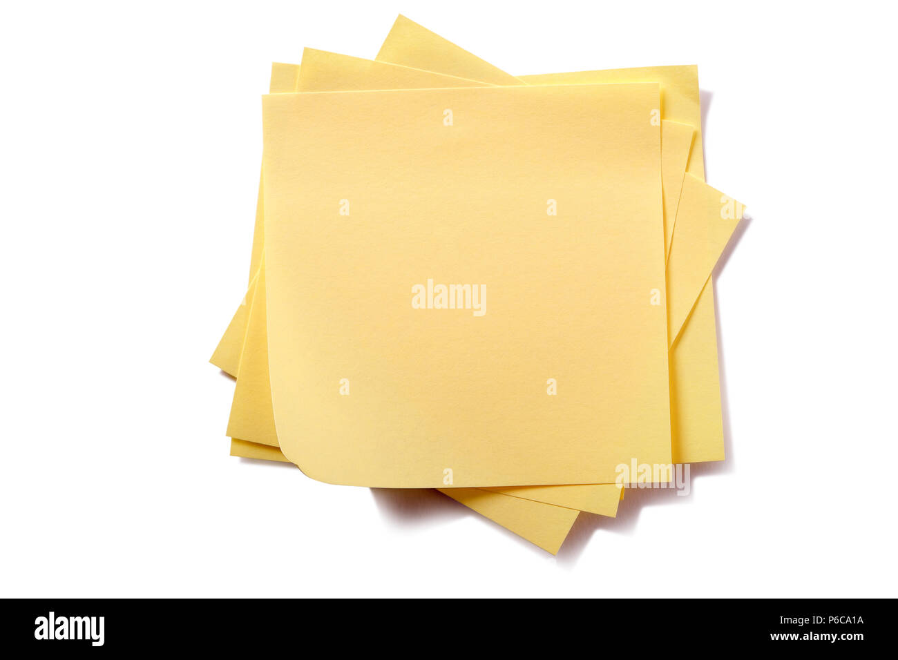 Untidy stack yellow sticky post notes isolated on white Stock Photo - Alamy