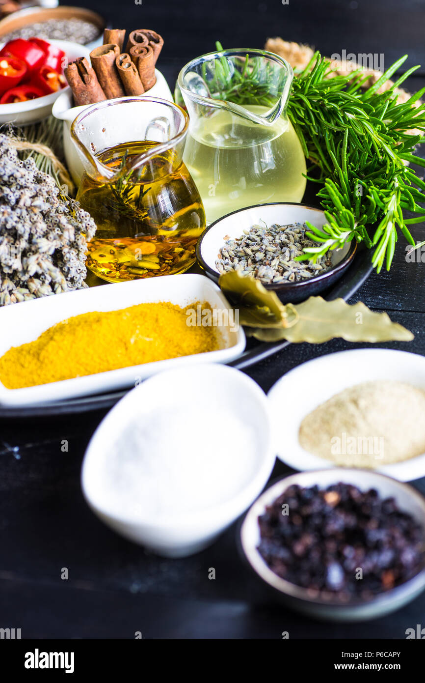 Organic food concept with different spices and herbs on rustic ...