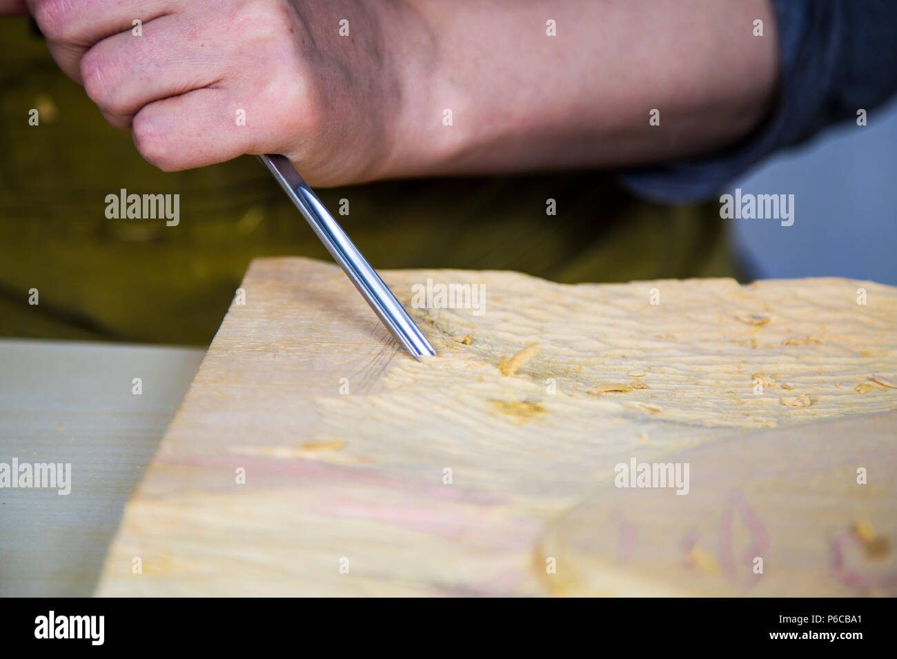 Hand of carver carving wood. Work Of Artist Stock Photo - Alamy