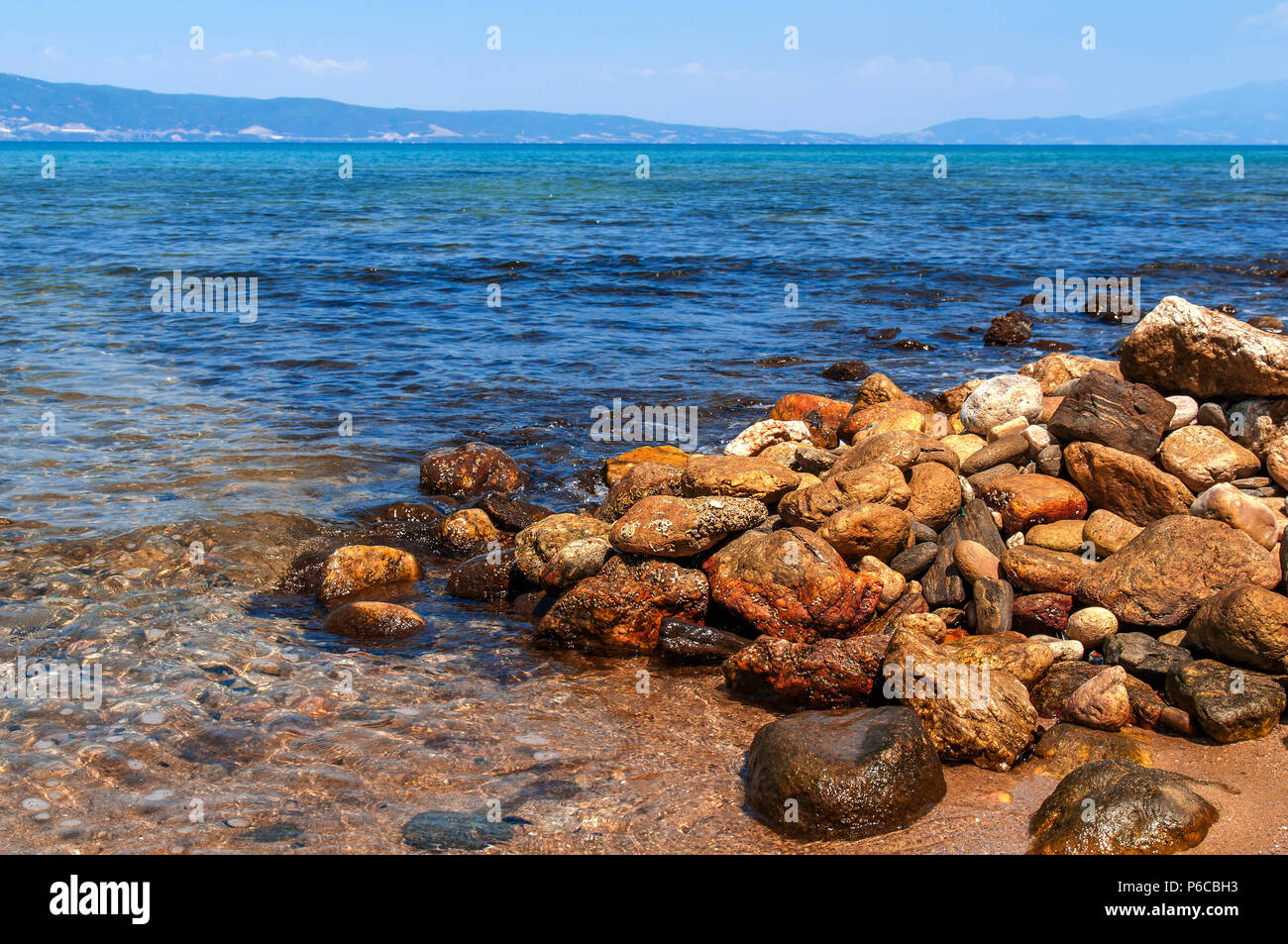 Stony sea shore sea background Stock Photo - Alamy