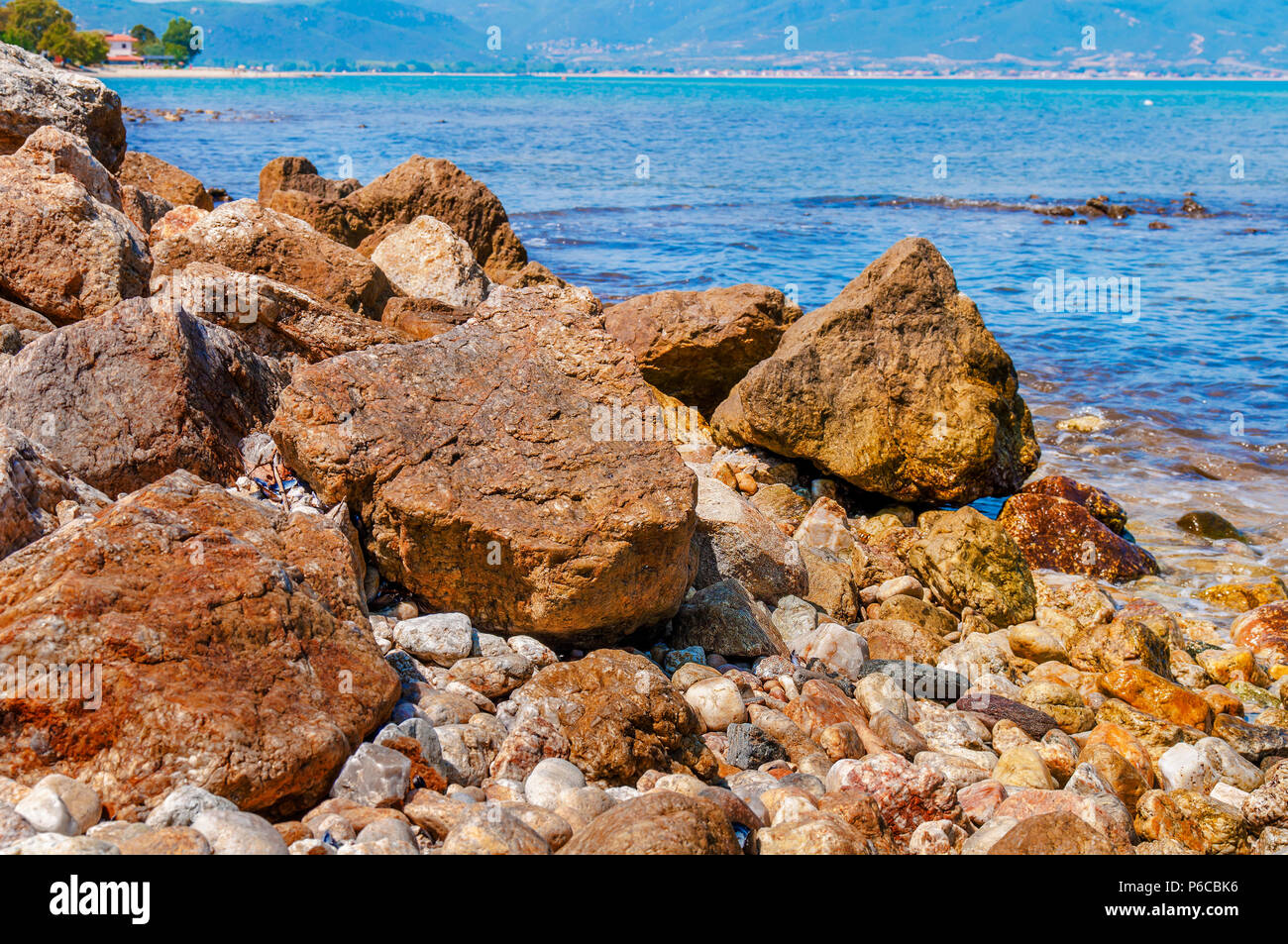 Stony sea shore sea background Stock Photo - Alamy