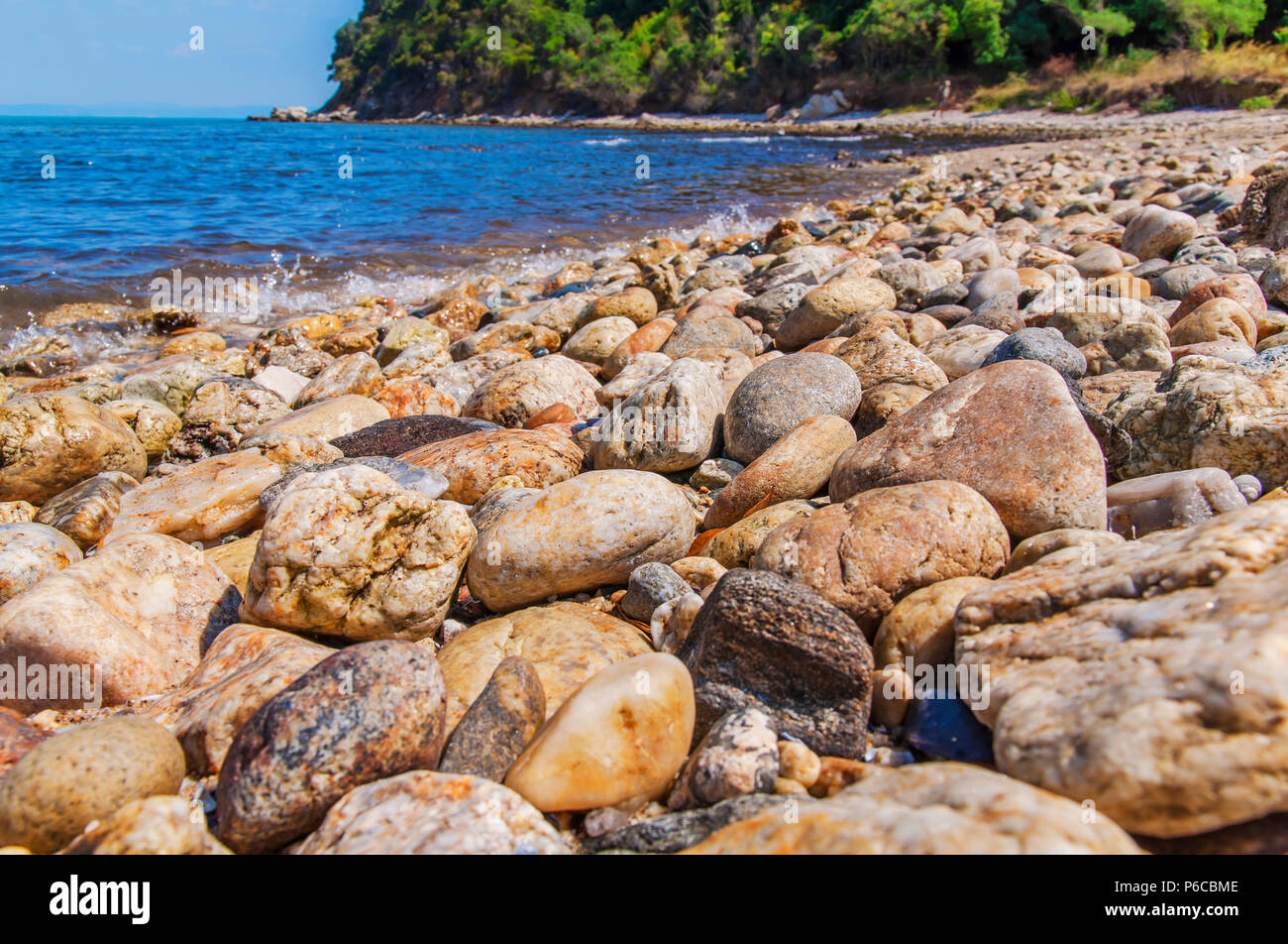 Stony sea shore sea background Stock Photo - Alamy