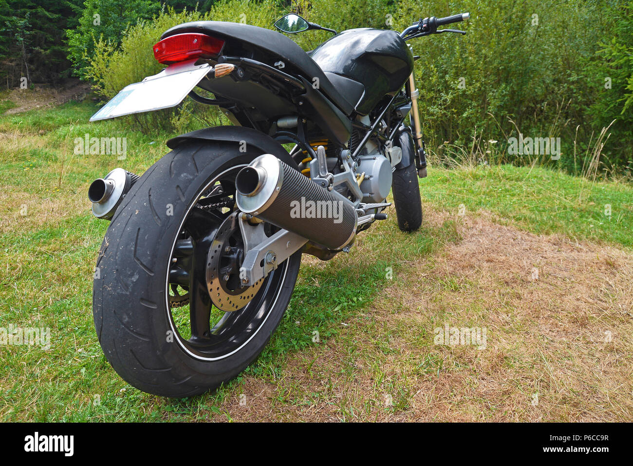 sports motorcycle parked on lawn Stock Photo - Alamy