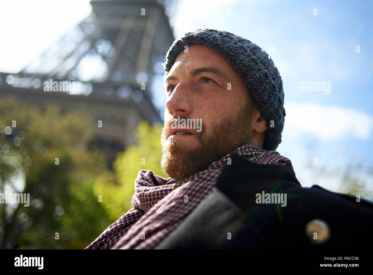 Stunning images of a young caucasian man sitting on a bench around the ...