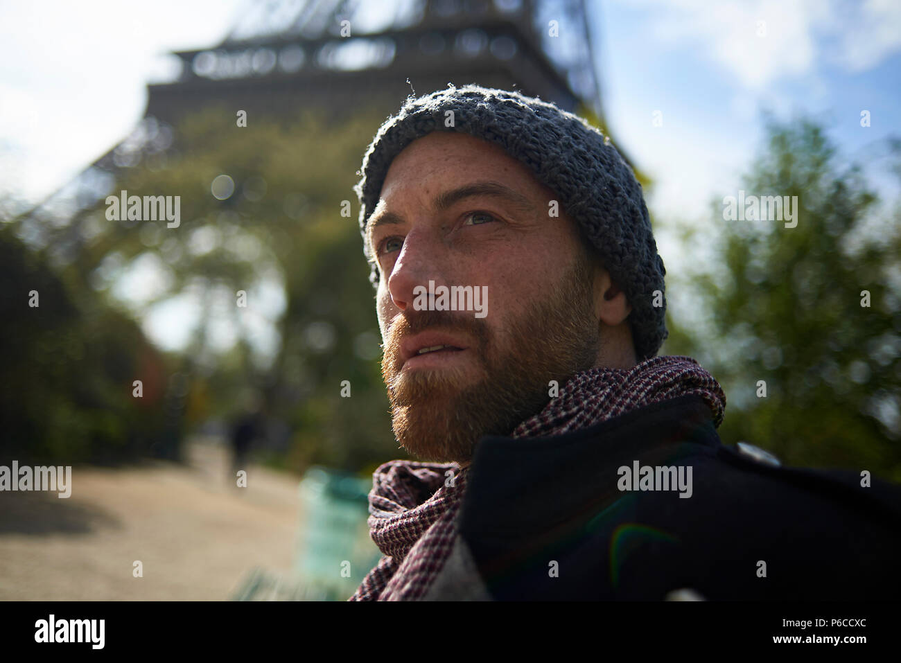 Stunning images of a young caucasian man sitting on a bench around the ...