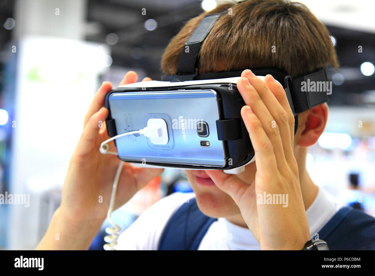 Teenager using augmented reality mask Stock Photo - Alamy