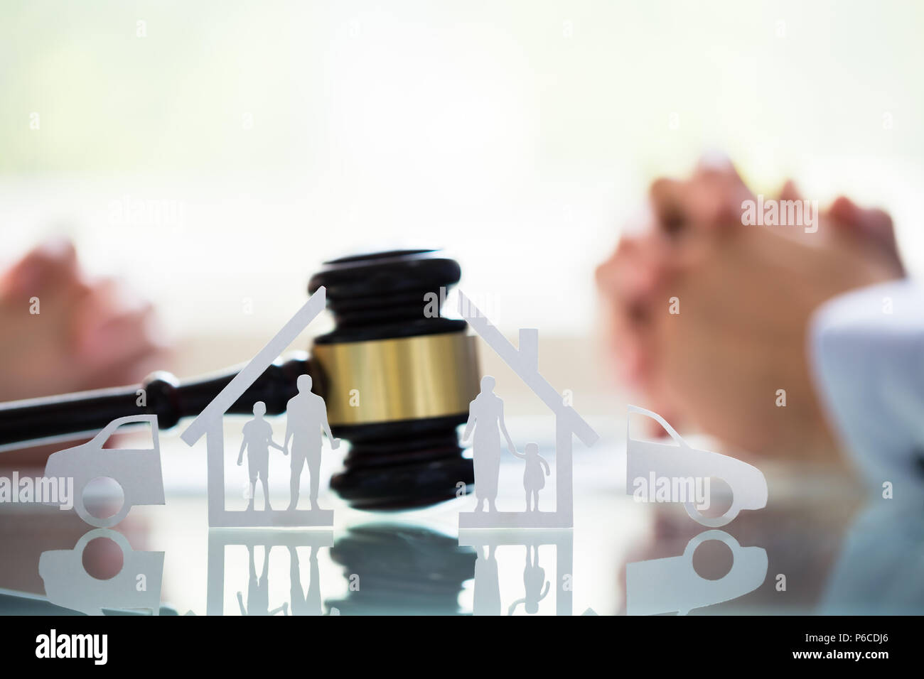 Mallet Between The Split Paper Cutout Family And Car In Front Of Couple ...