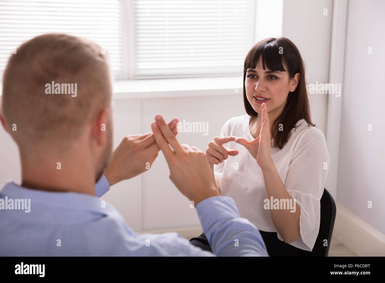 Disabilities showing sign language hi-res stock photography and images ...