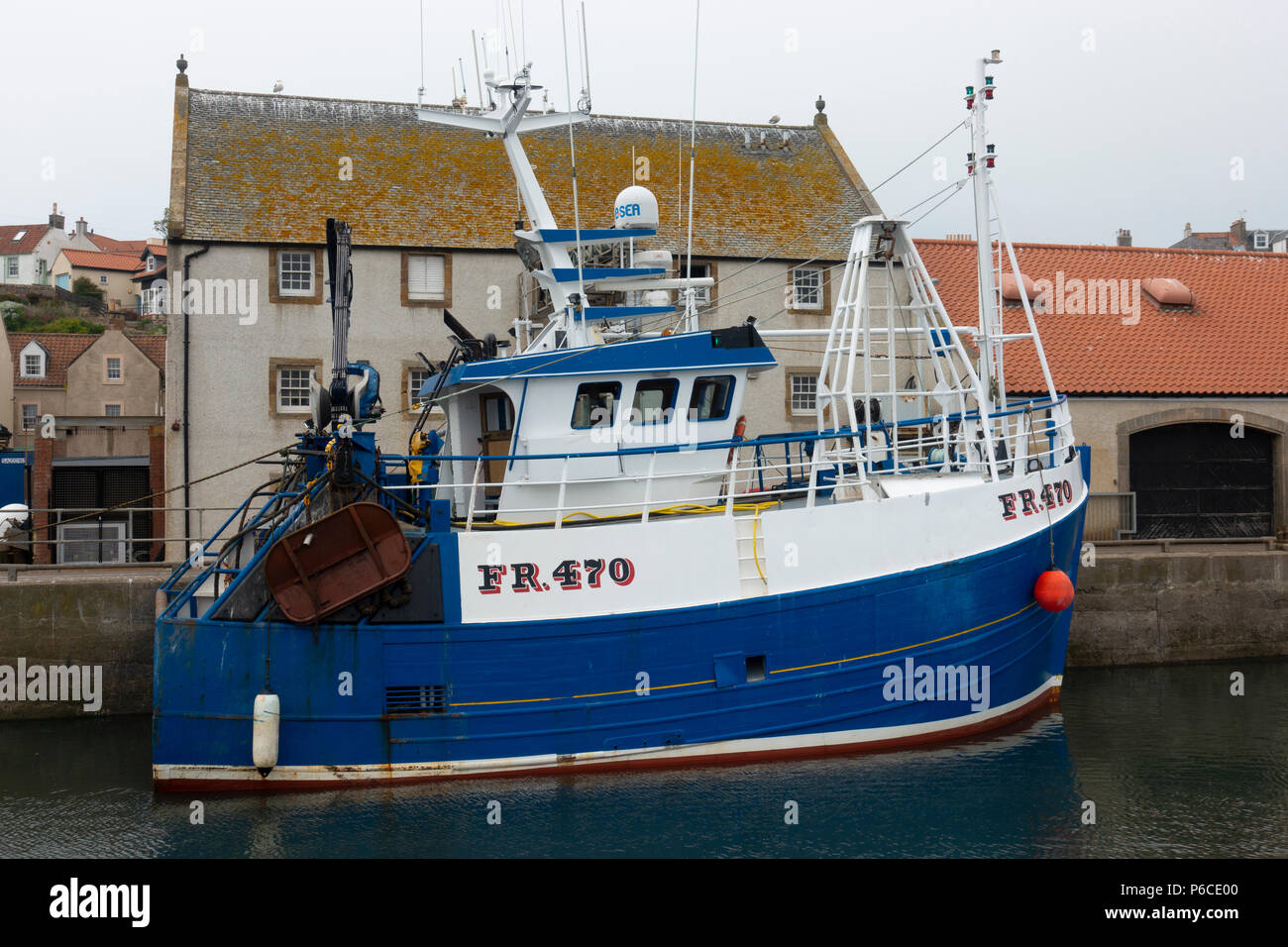 View of fishing trawler in harbour at Pittenweem village in the East ...
