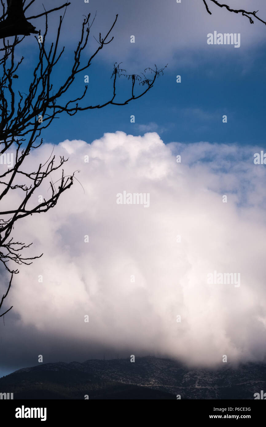 Strange white Cloud formation overhanging the edge of Athens mountains ...